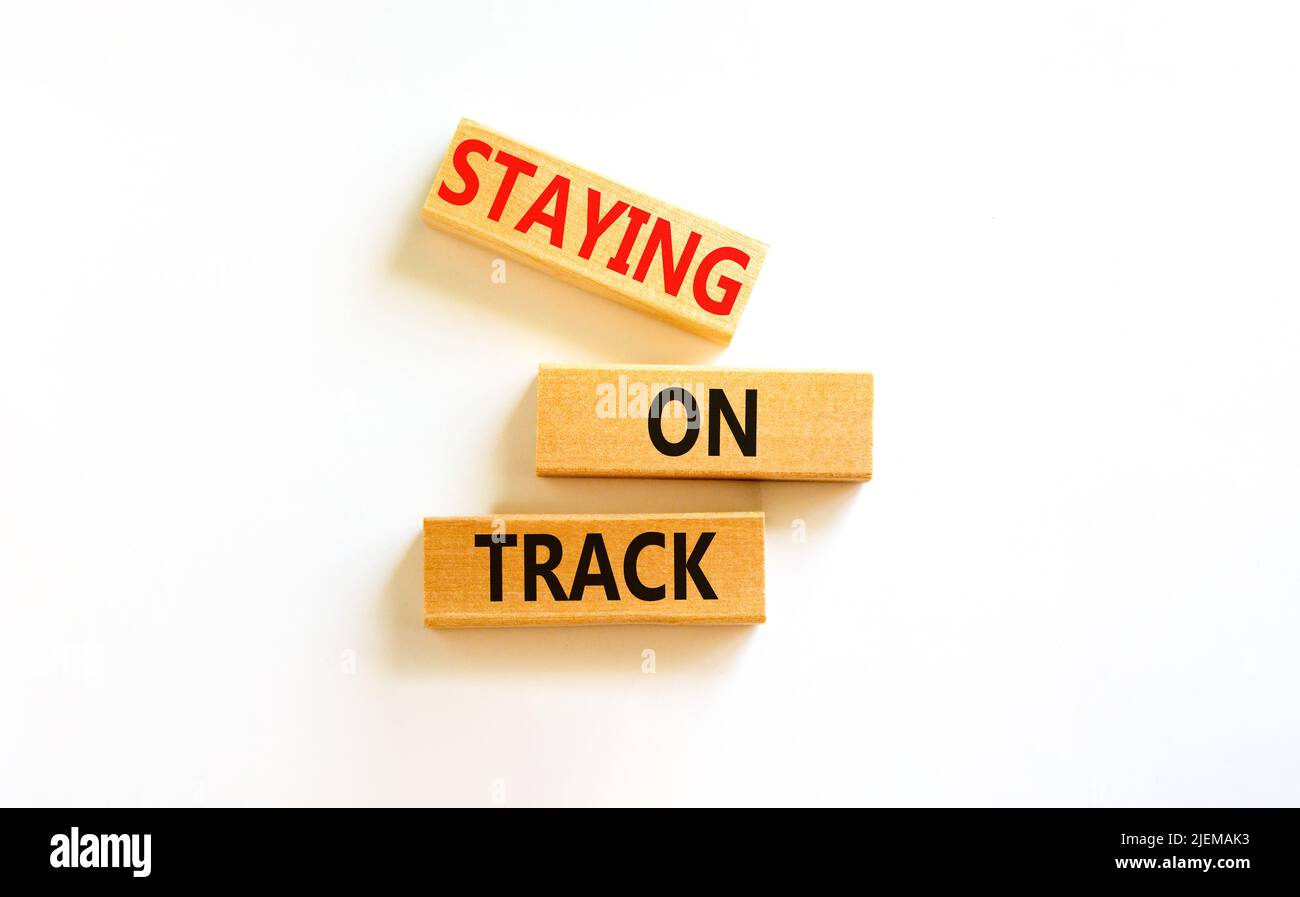 Staying on track symbol. Concept words Staying on track on wooden ...
