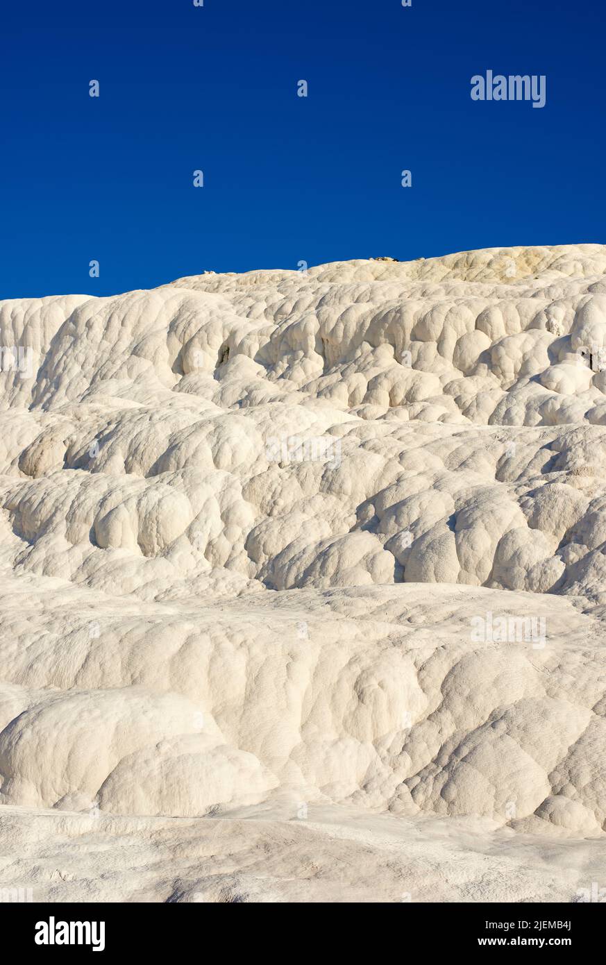 The Travertine pools and terraces in Pamukkale, Turkey. Desert sand ...