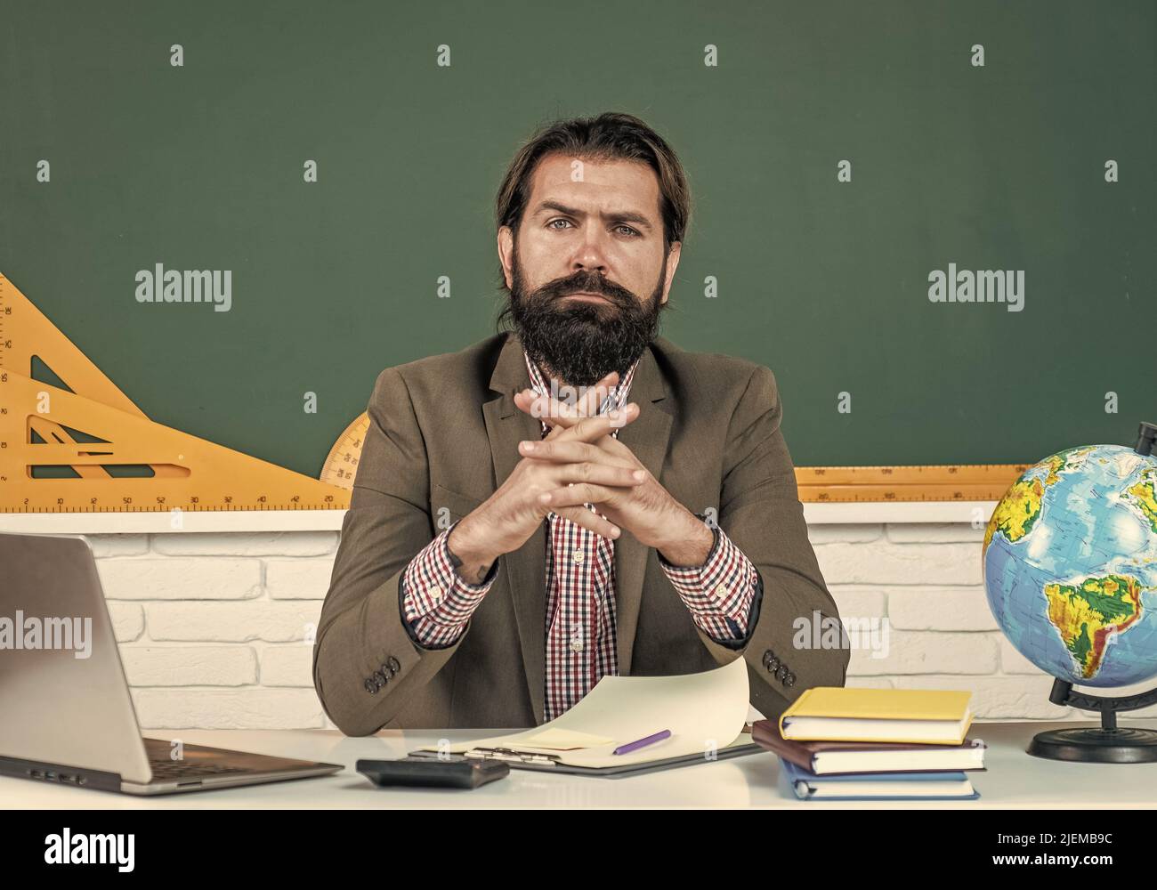 very hard day. brutal man with beard wear costume. informal education ...