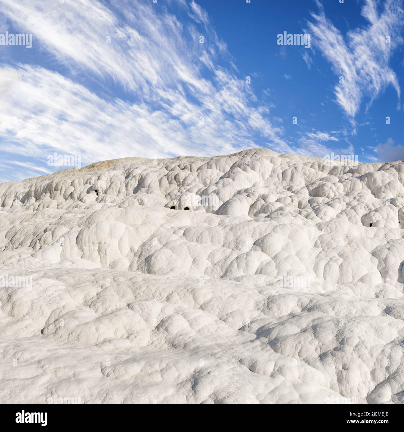 Scenic view of travertine terraces in Pamukkale Turkey. Crystallised ...