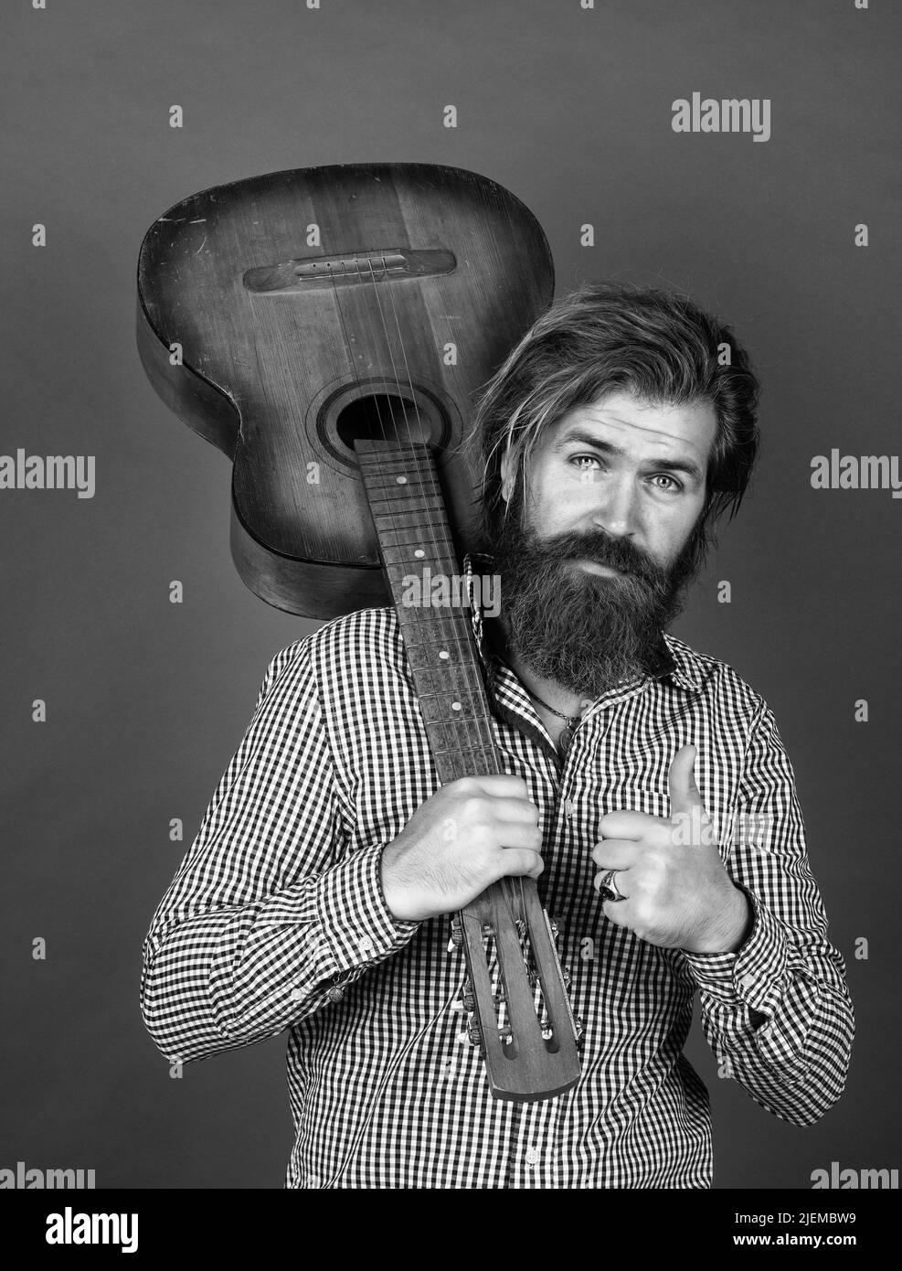 music concept. brutal handsome man with moustache play guitar. mature ...