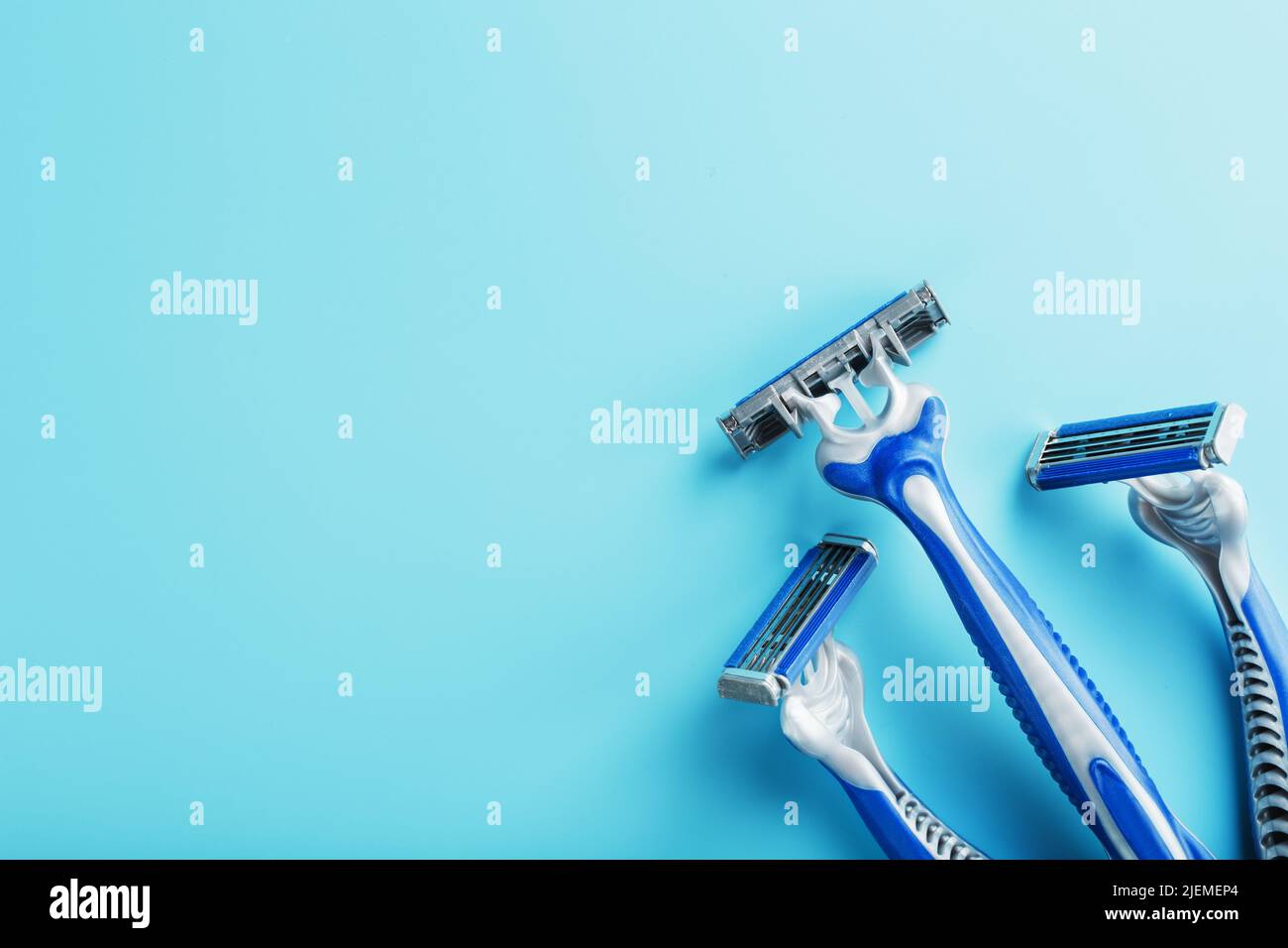 Blue shaving machine with sharp blades on the background of ice cubes ...