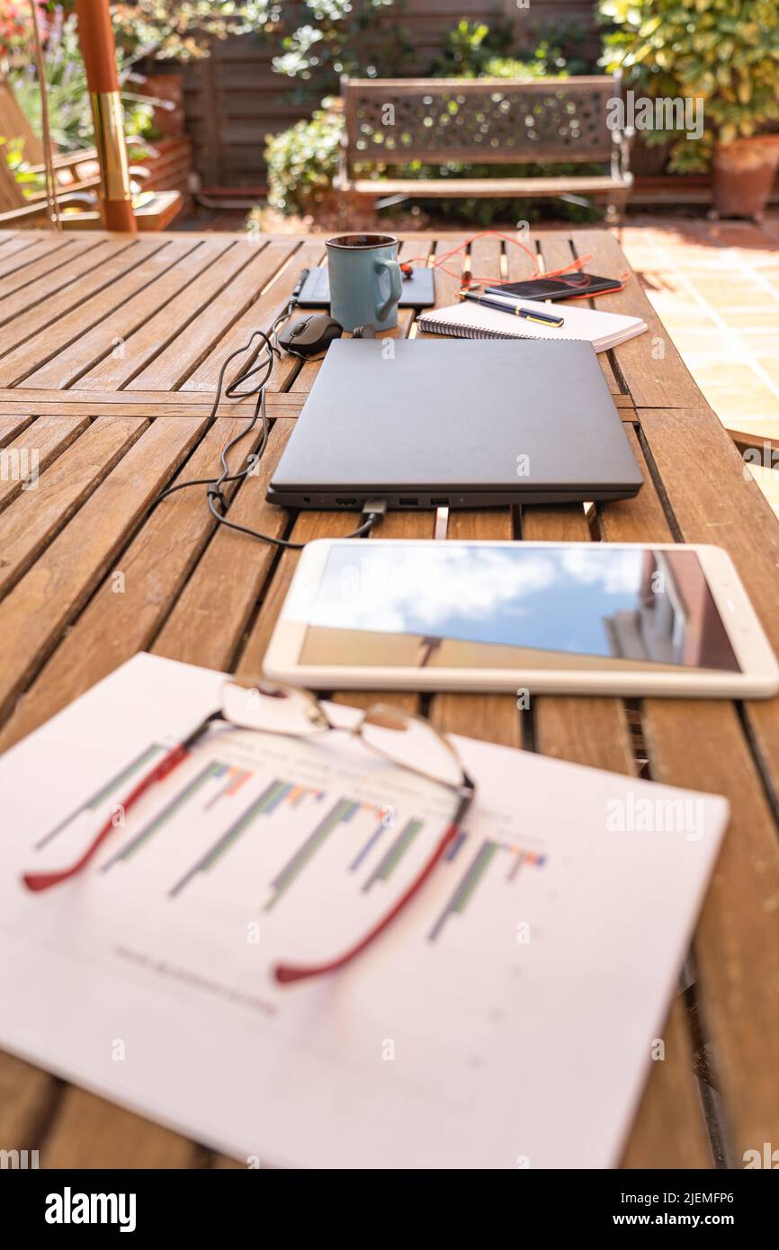 Workstation at home to telework from the garden with laptop and tablet ...