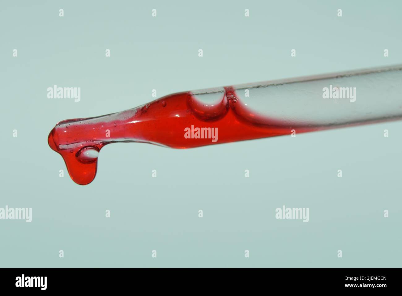 Close-up of a pipette with blood. The concept of developing ...