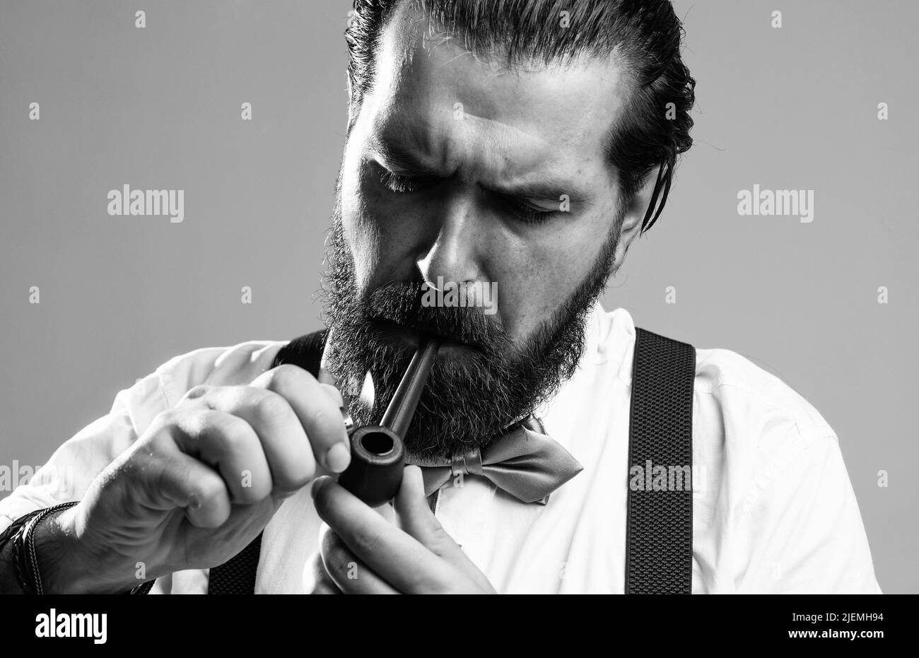 old fashioned bearded hipster smoke pipe. brutal handsome man with ...