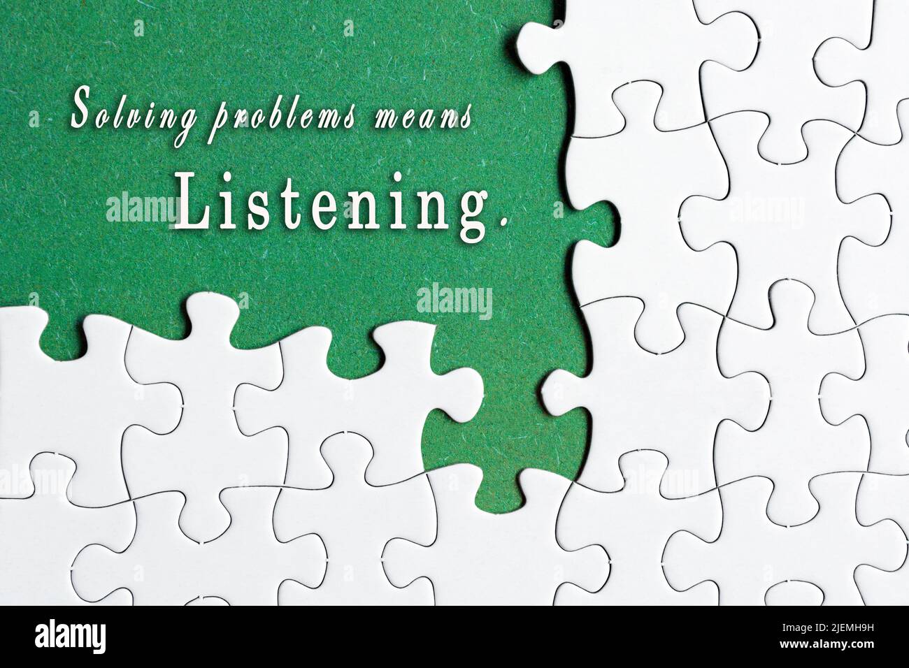 Motivational quote on white jigsaw puzzle with some missing pieces on ...