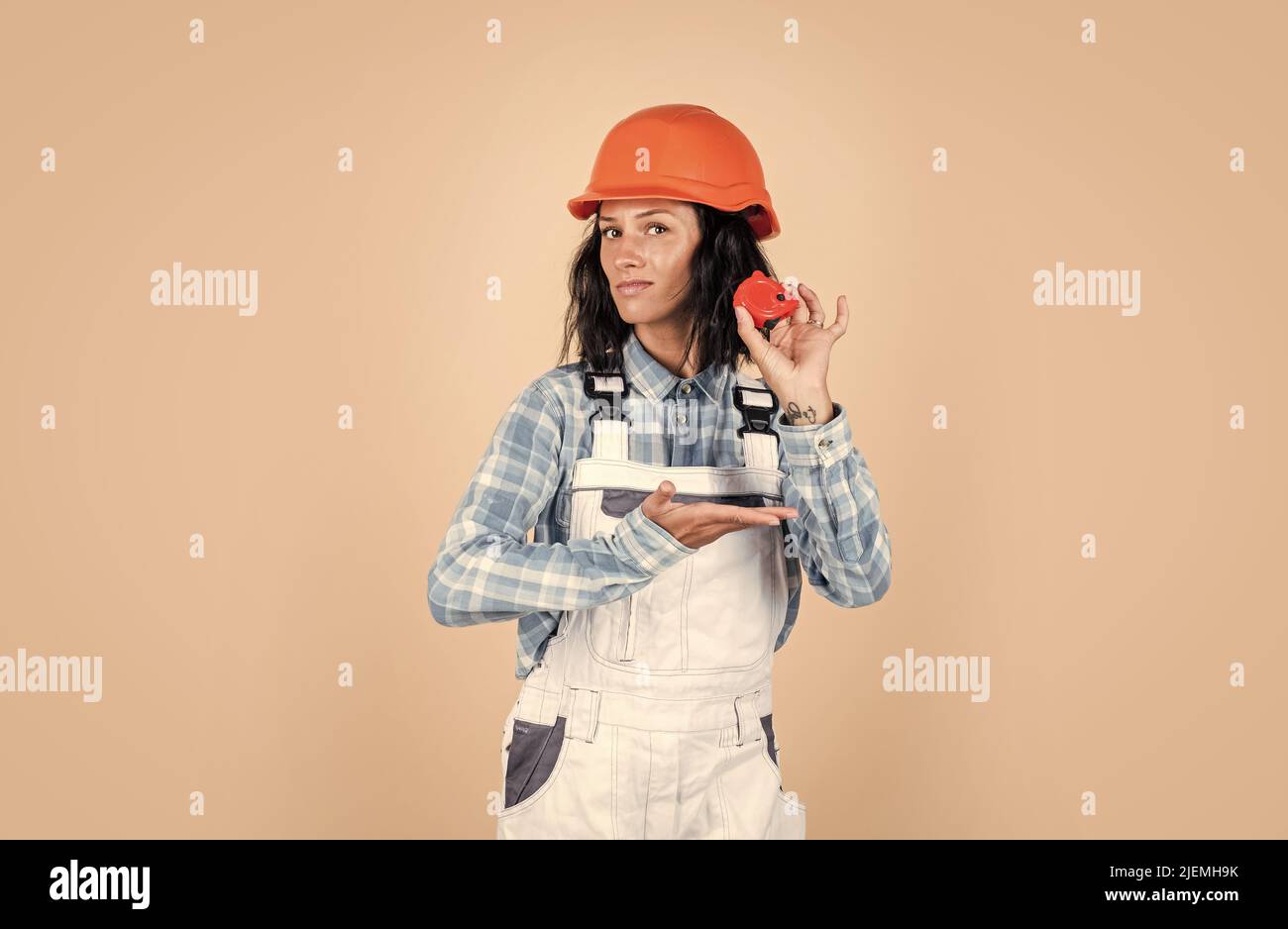 Think differently. architect working with tape measure. female foreman ...