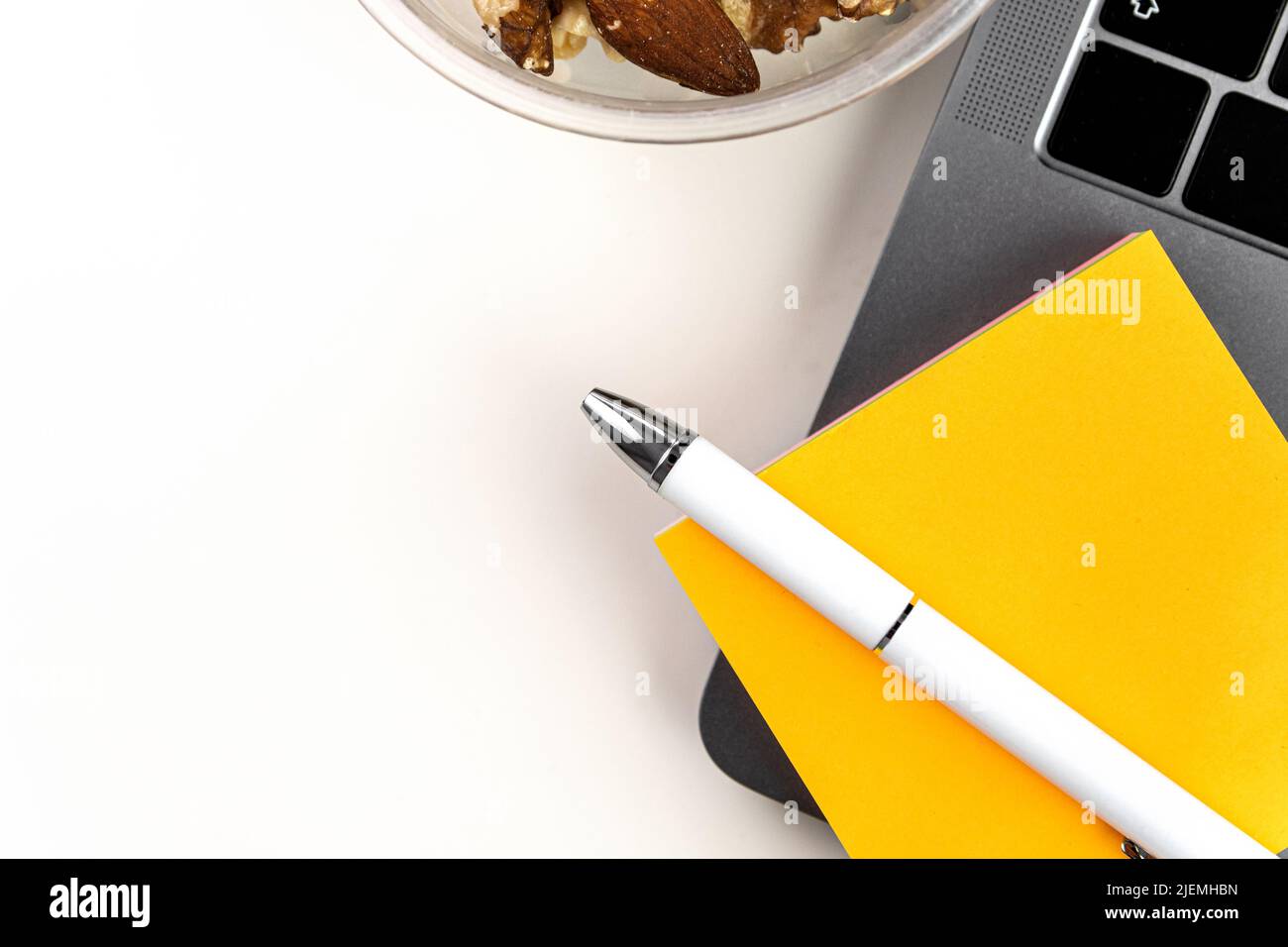 White office desk with pen, colorful stickers, laptop and other office ...