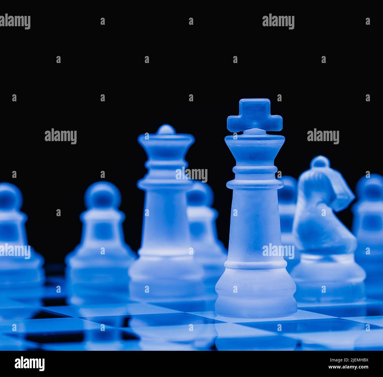 Glass chess on chess board. Photographed up close with the black ...