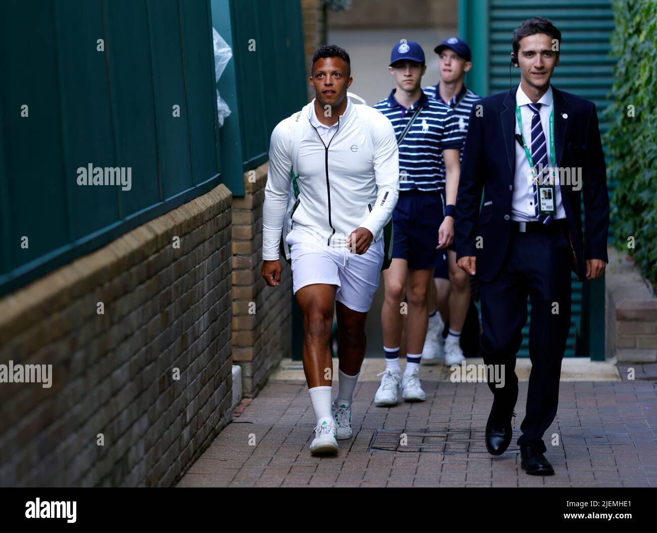 Jay Clark walking to Court 18 before his match against Christian ...