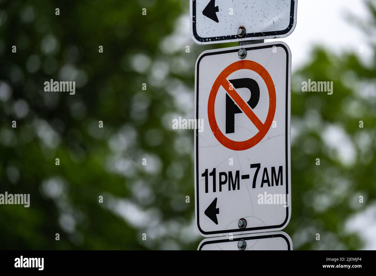 Close-up of a metal sign no parking sign, prohibiting overnight parking ...