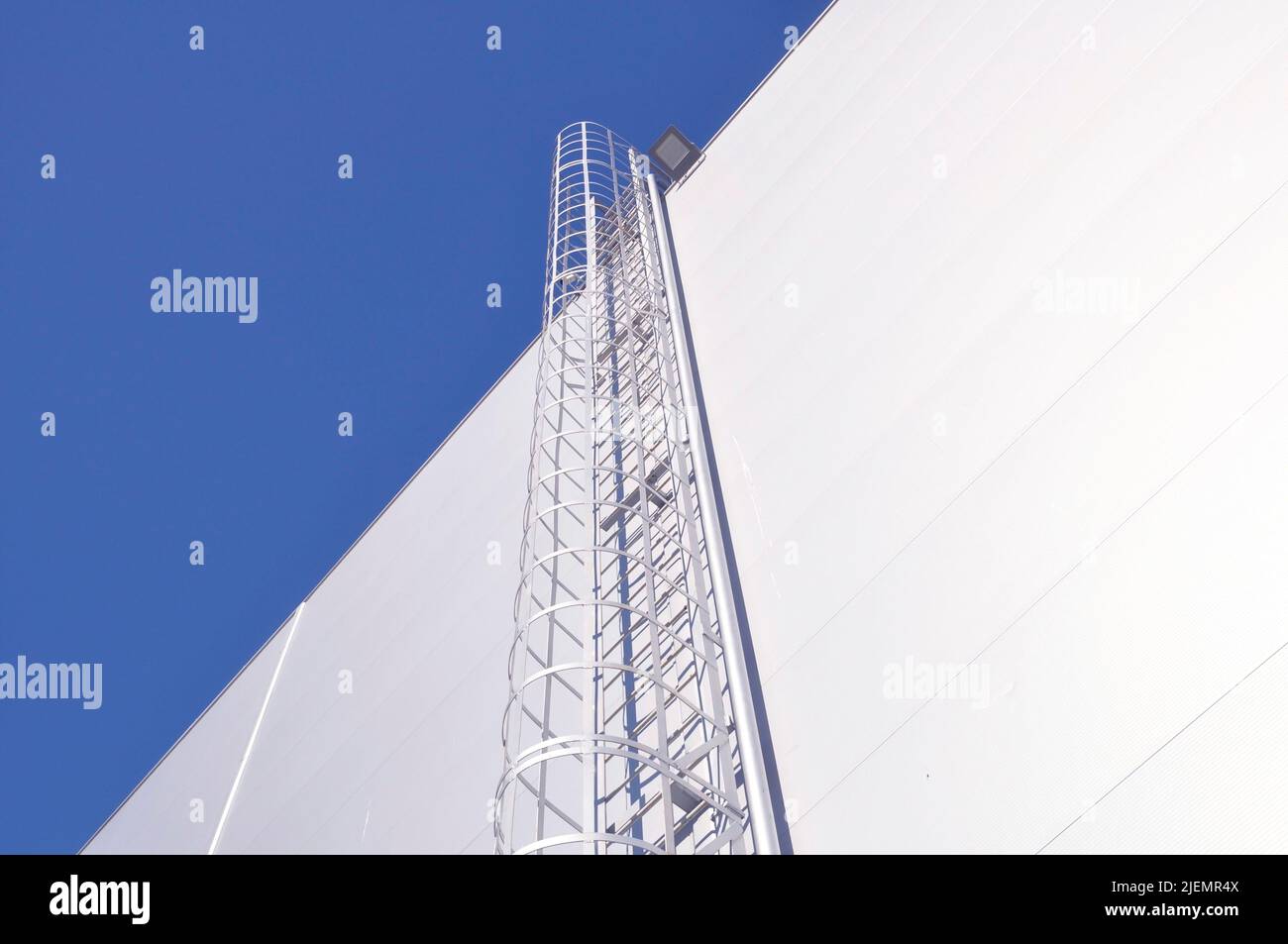 a fire escape leading to the roof of a building made of metal ...
