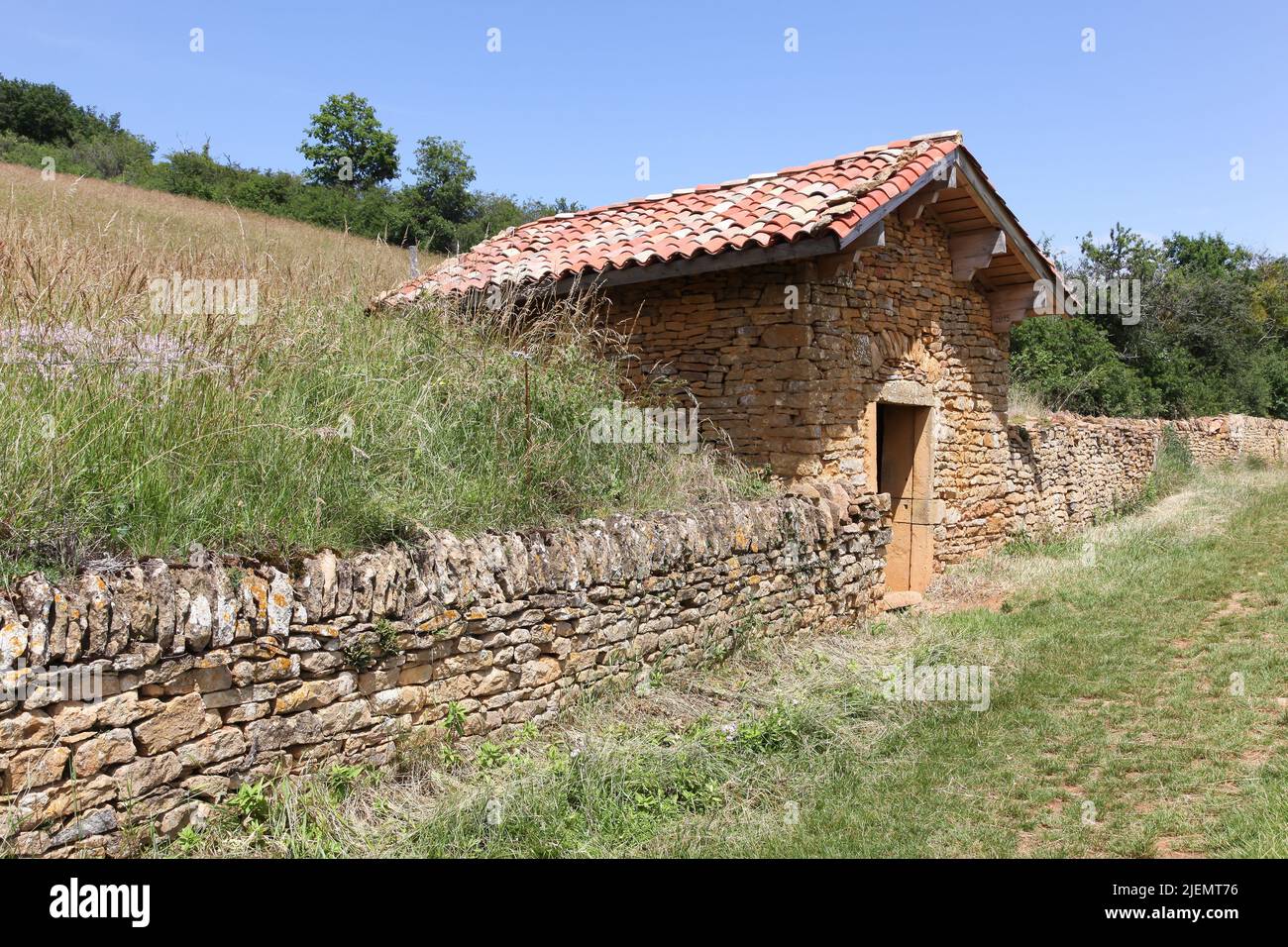 Typical stone hut called cadole in french language in Theize ...