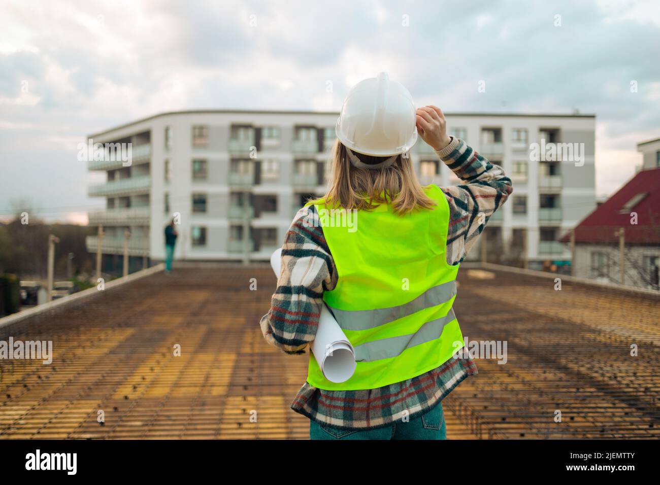 Female construction worker under inspection and checking standing on ...