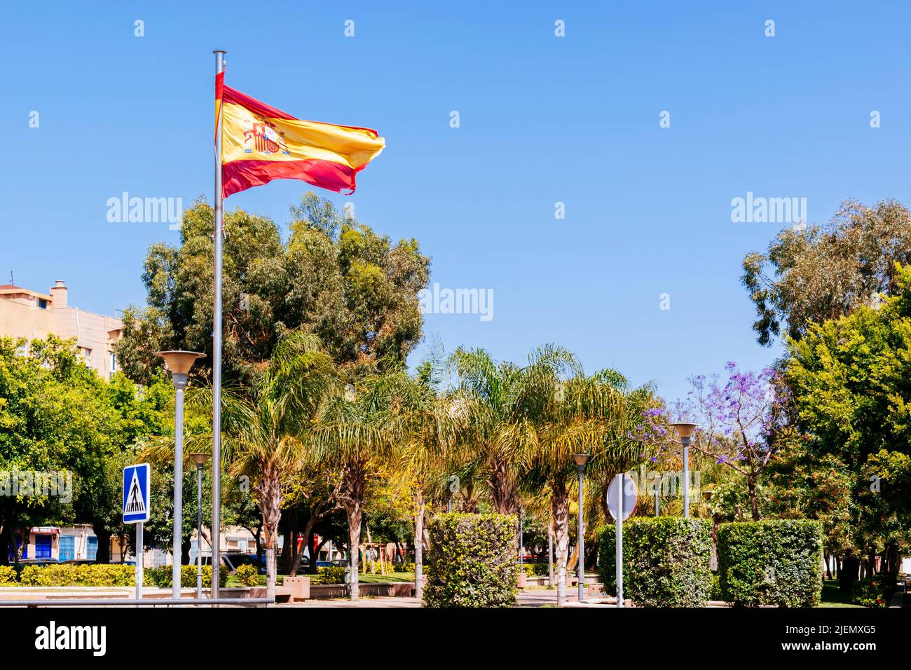 Spanish flag waving on the boulevard Europa next to the border of Beni ...