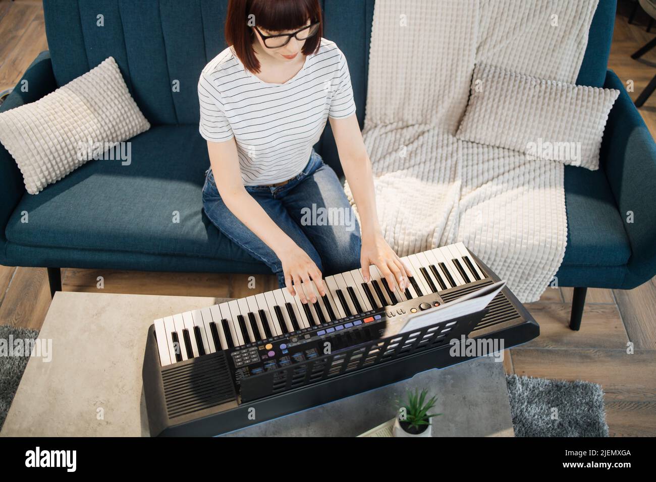 Close up of hand of caucasian girl playing piano. Pretty women in music ...