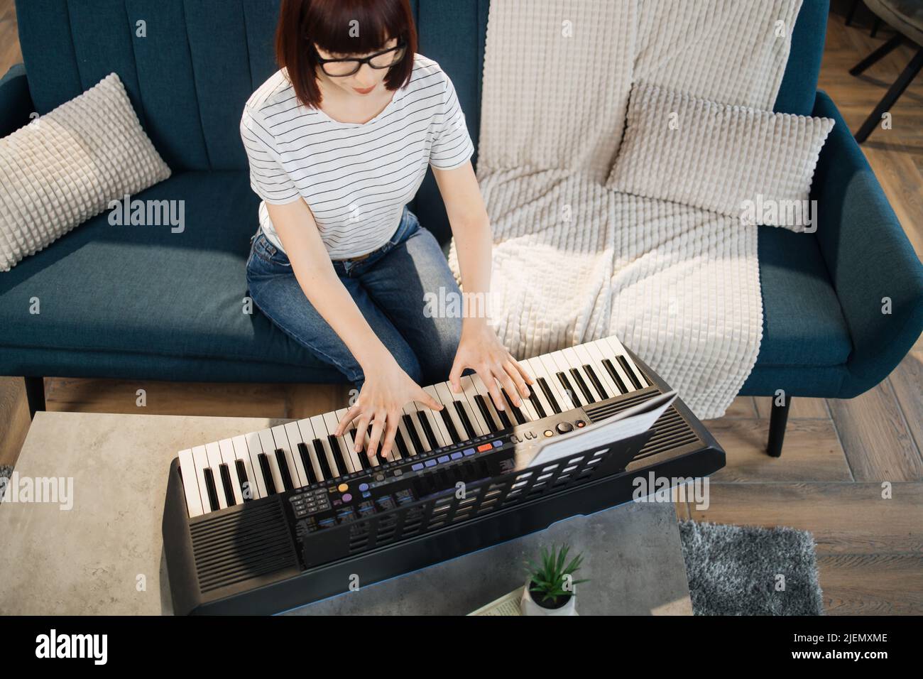 Close up of hand of caucasian girl playing piano. Pretty women in music ...