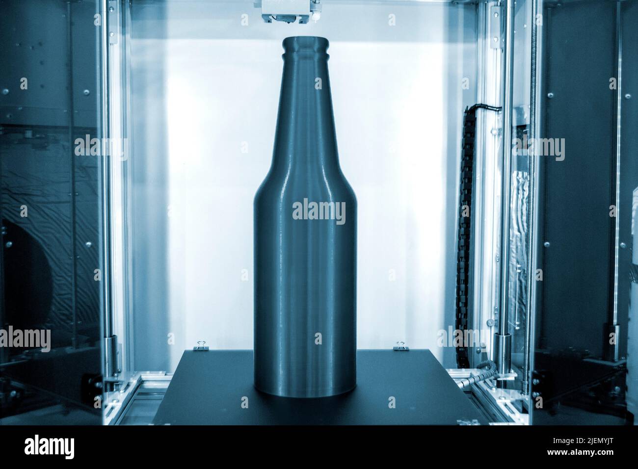Object bottle printed on 3D printer close-up, inside on desktop of 3d ...