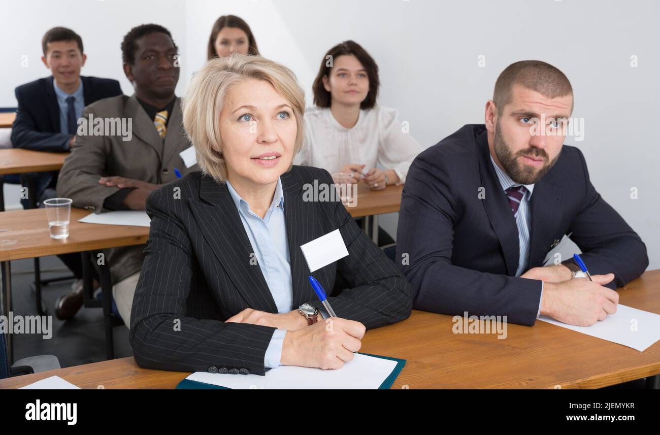 People during business seminar in lecture hall Stock Photo - Alamy