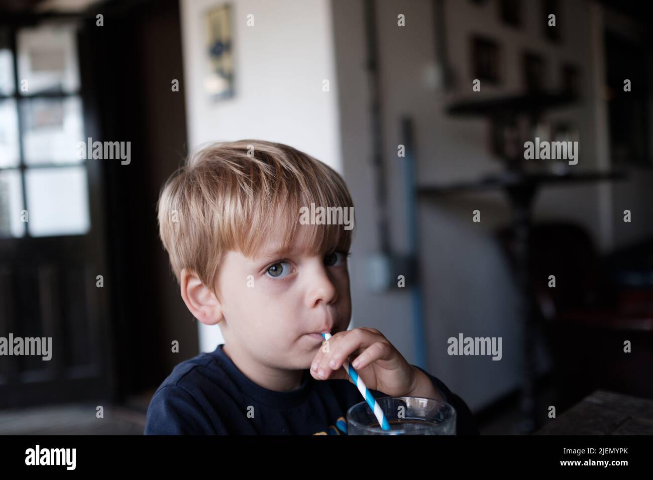 Child drinking through straw hi-res stock photography and images - Alamy