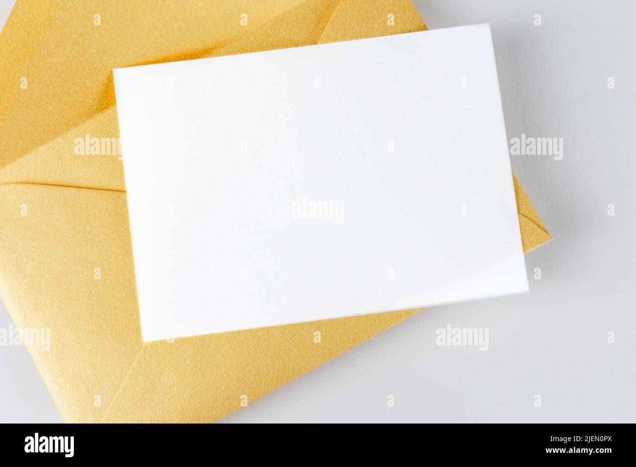 VIP invitation template mockup with blank paper sheet and golden ...