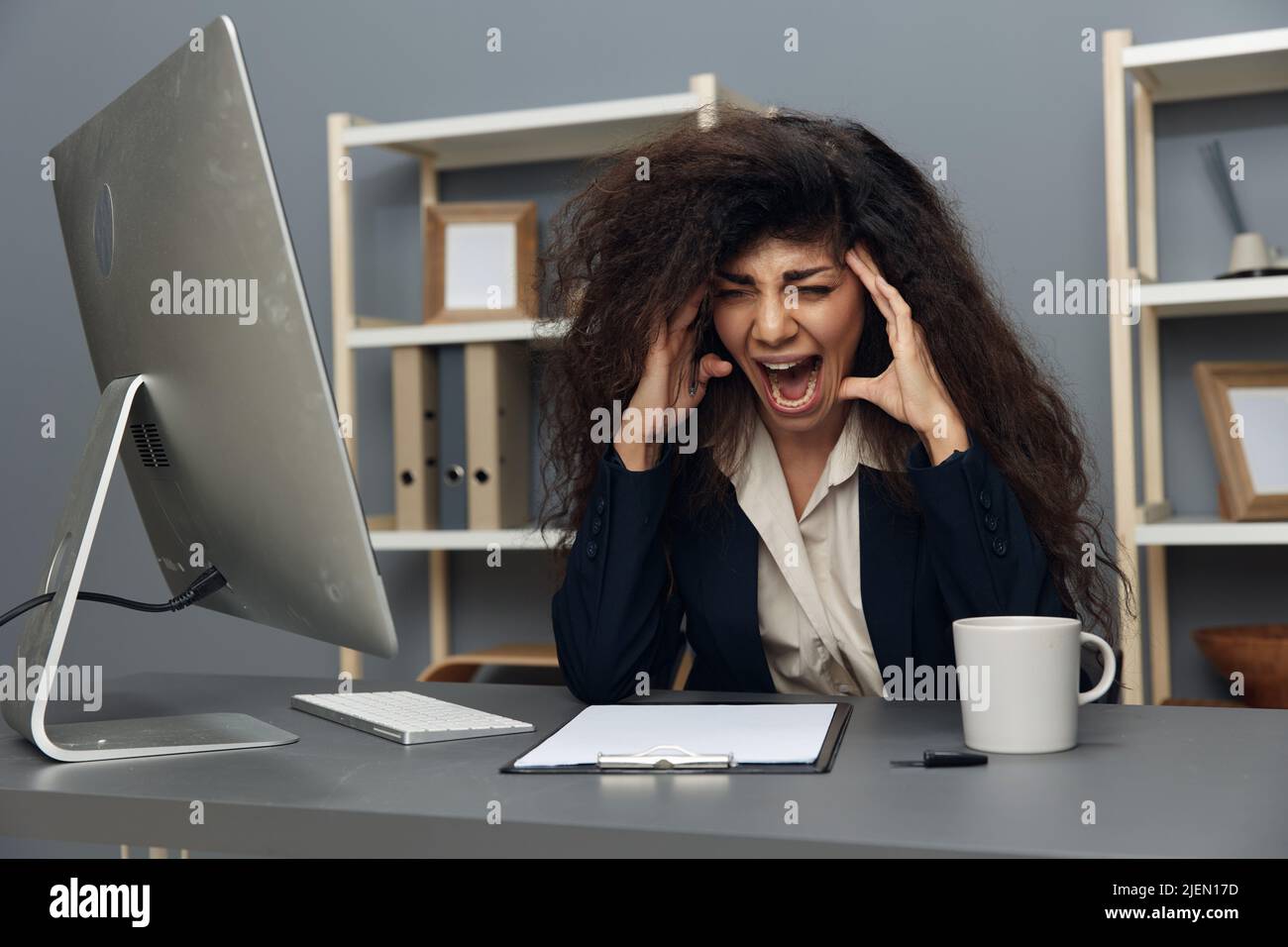 Suffering screaming angry tanned adorable curly Latin businesswoman in ...