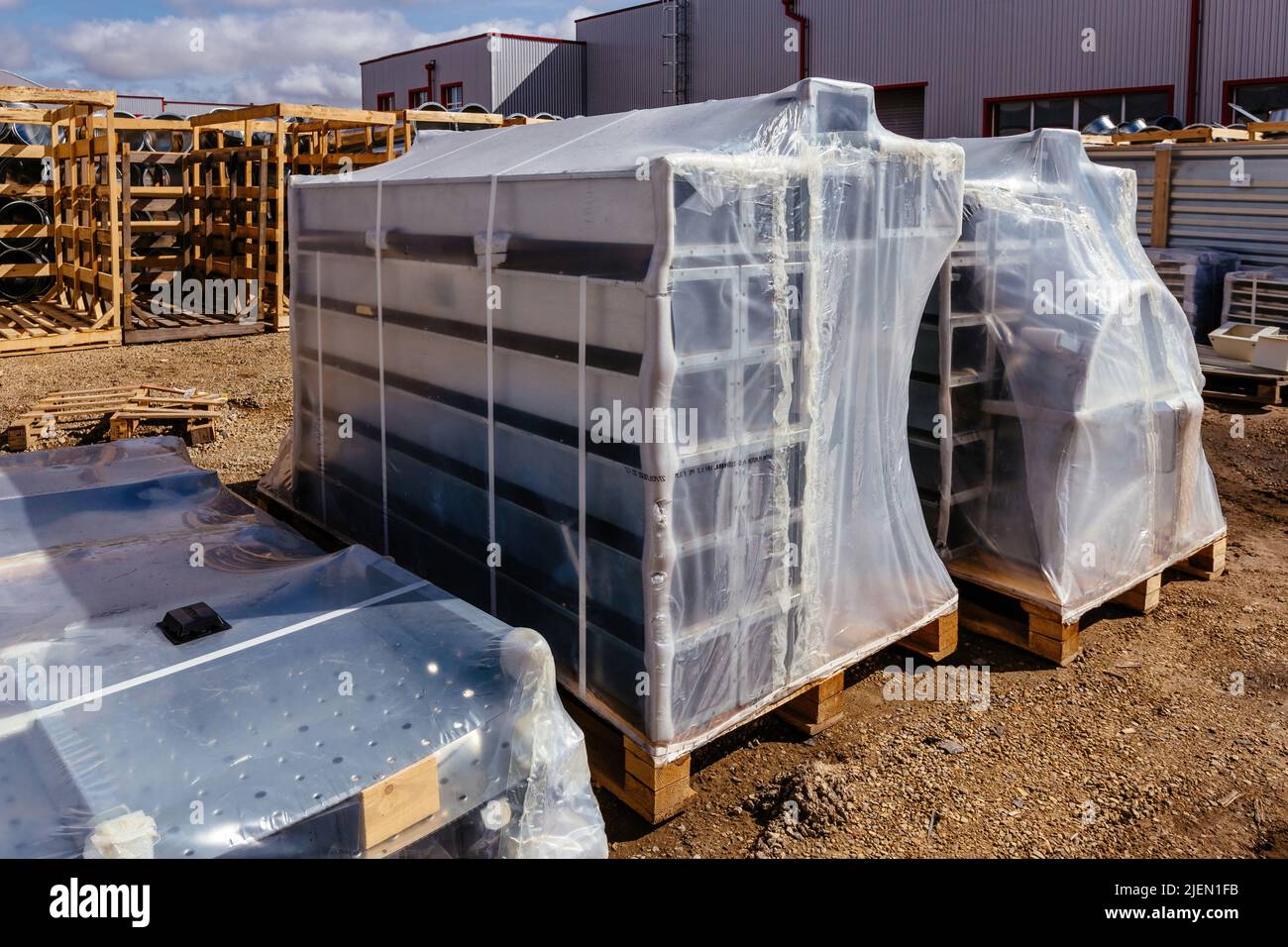 New manufactured steel spare parts packed in protective film in ...