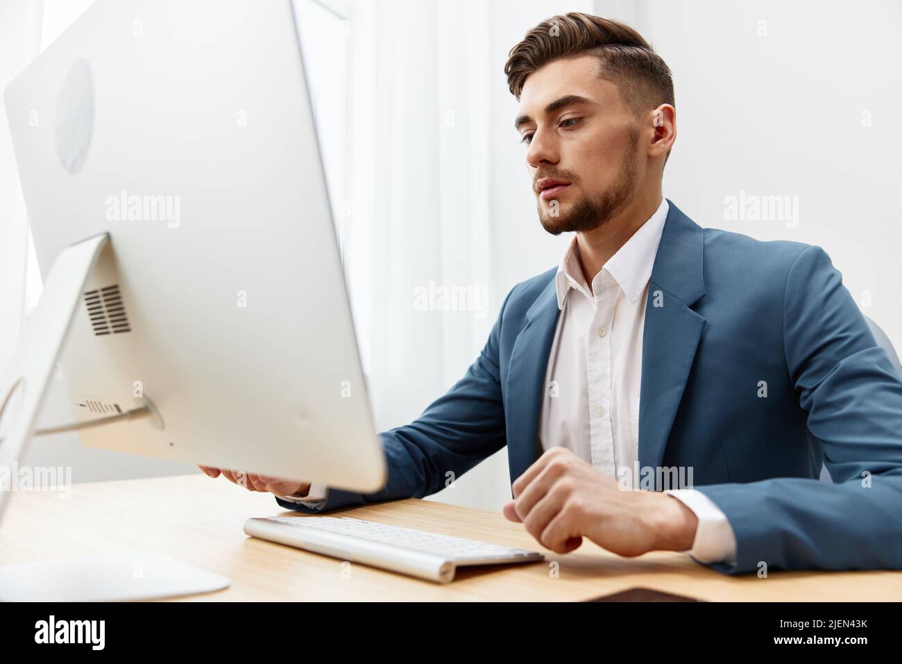 manager sitting at the computer work boss executive Stock Photo - Alamy