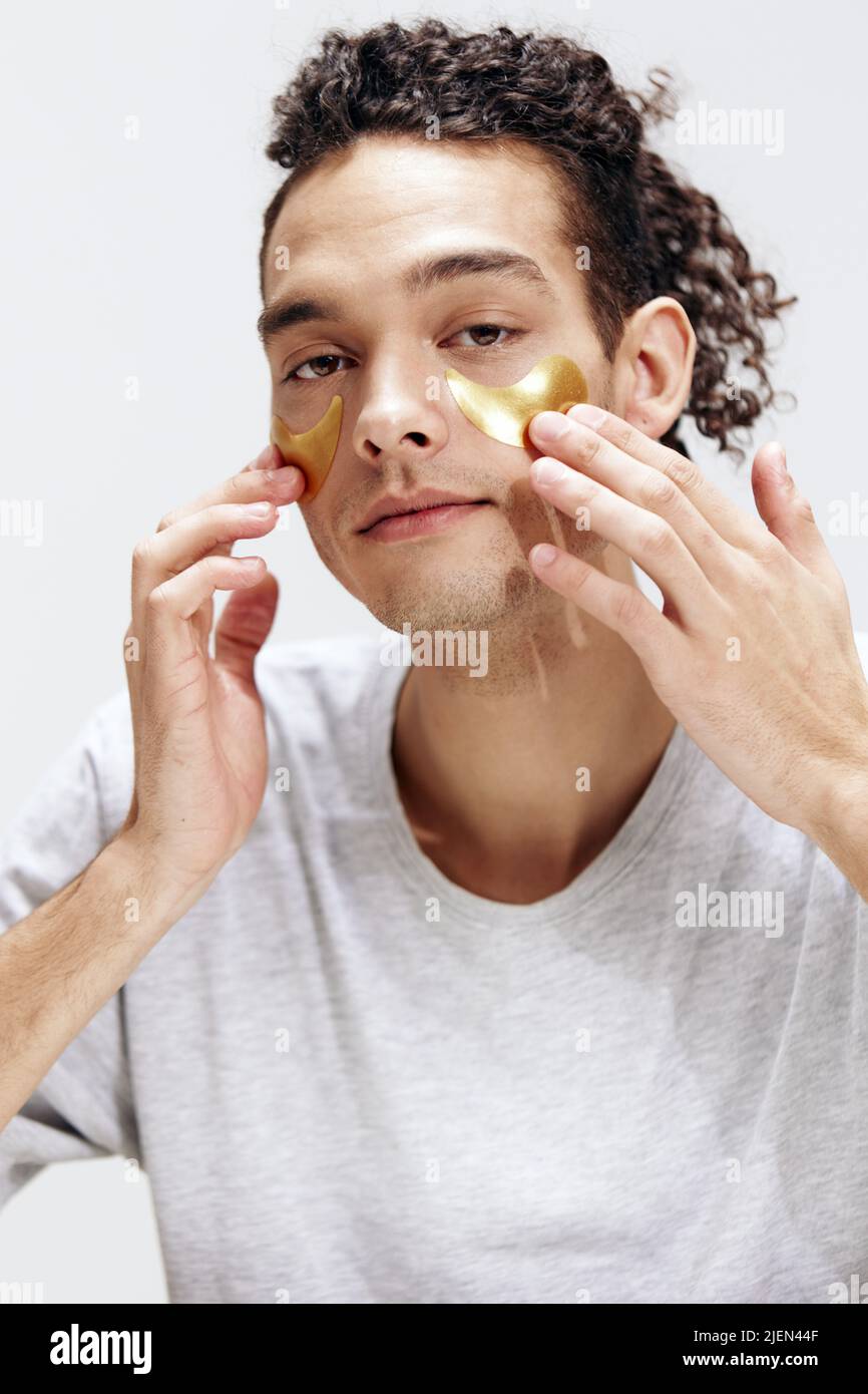 handsome guy golden patches on the face health cosmetology light ...