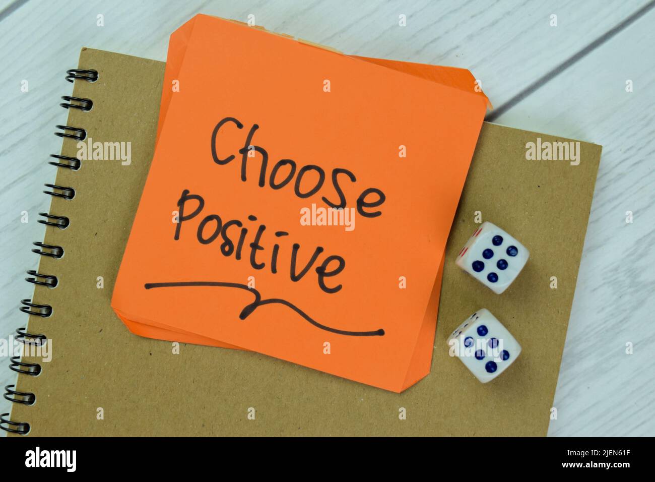 Concept of Choose Positive write on sticky notes isolated on Wooden ...