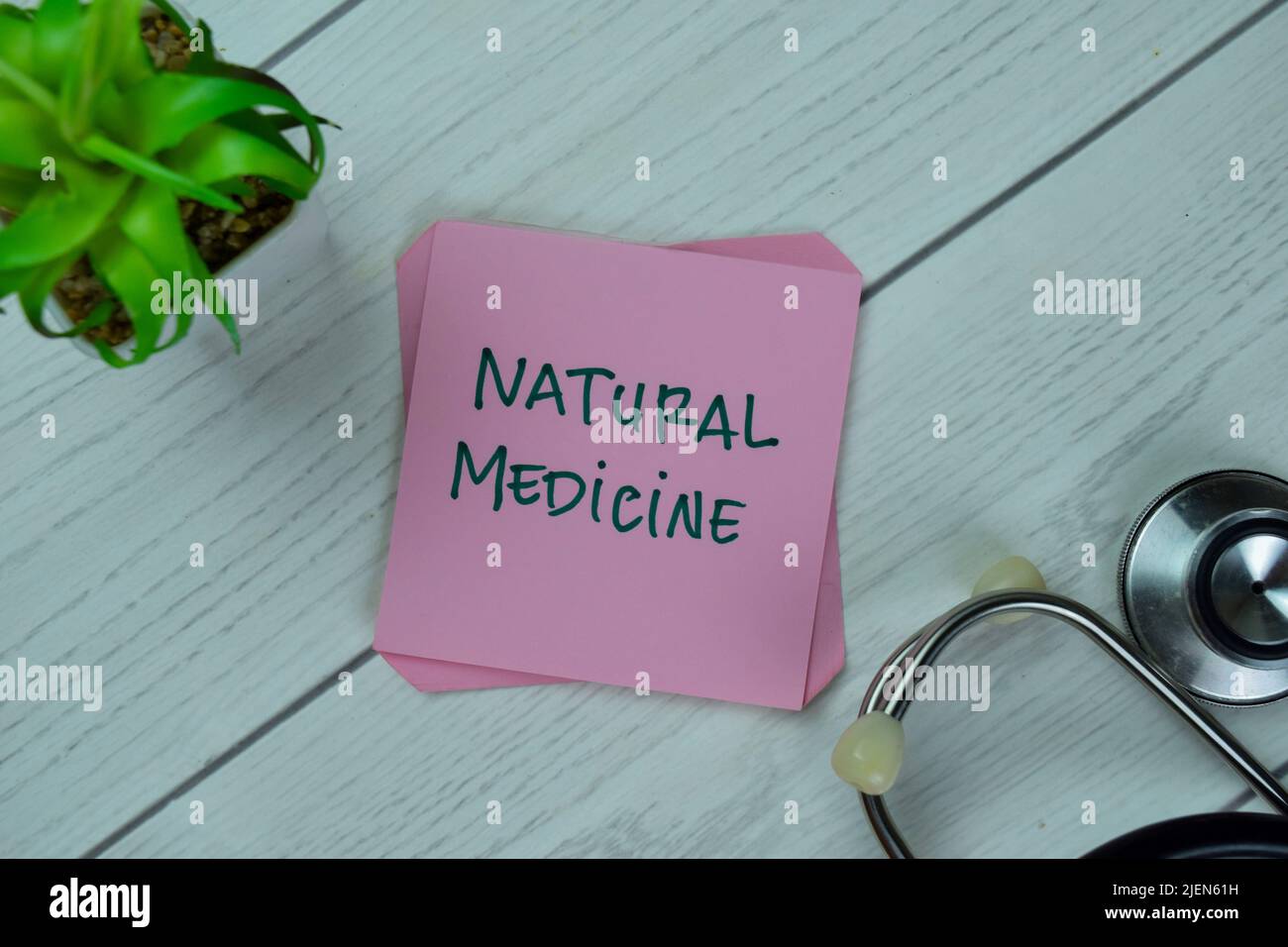 Concept of Natural Medicine write on sticky notes isolated on Wooden ...