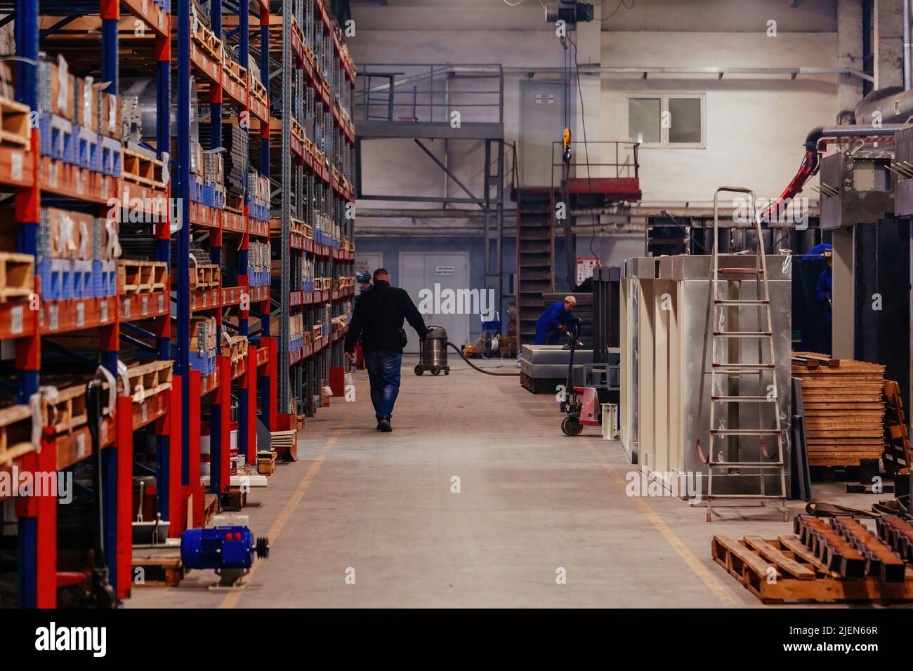 Industrial warehouse. Shelves with packs of goods Stock Photo - Alamy