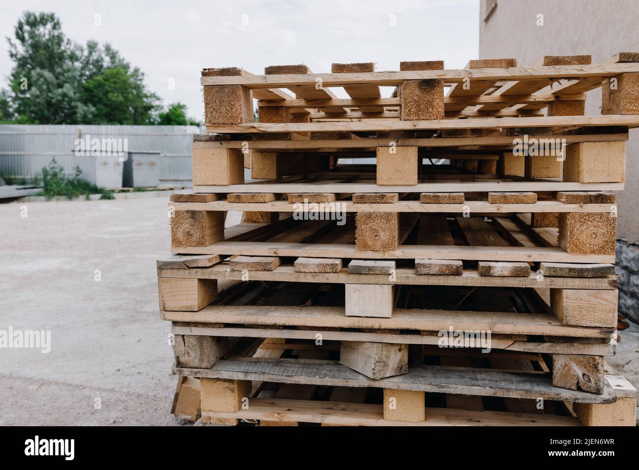 Wooden pallets lie on top of each other on the street Stock Photo - Alamy