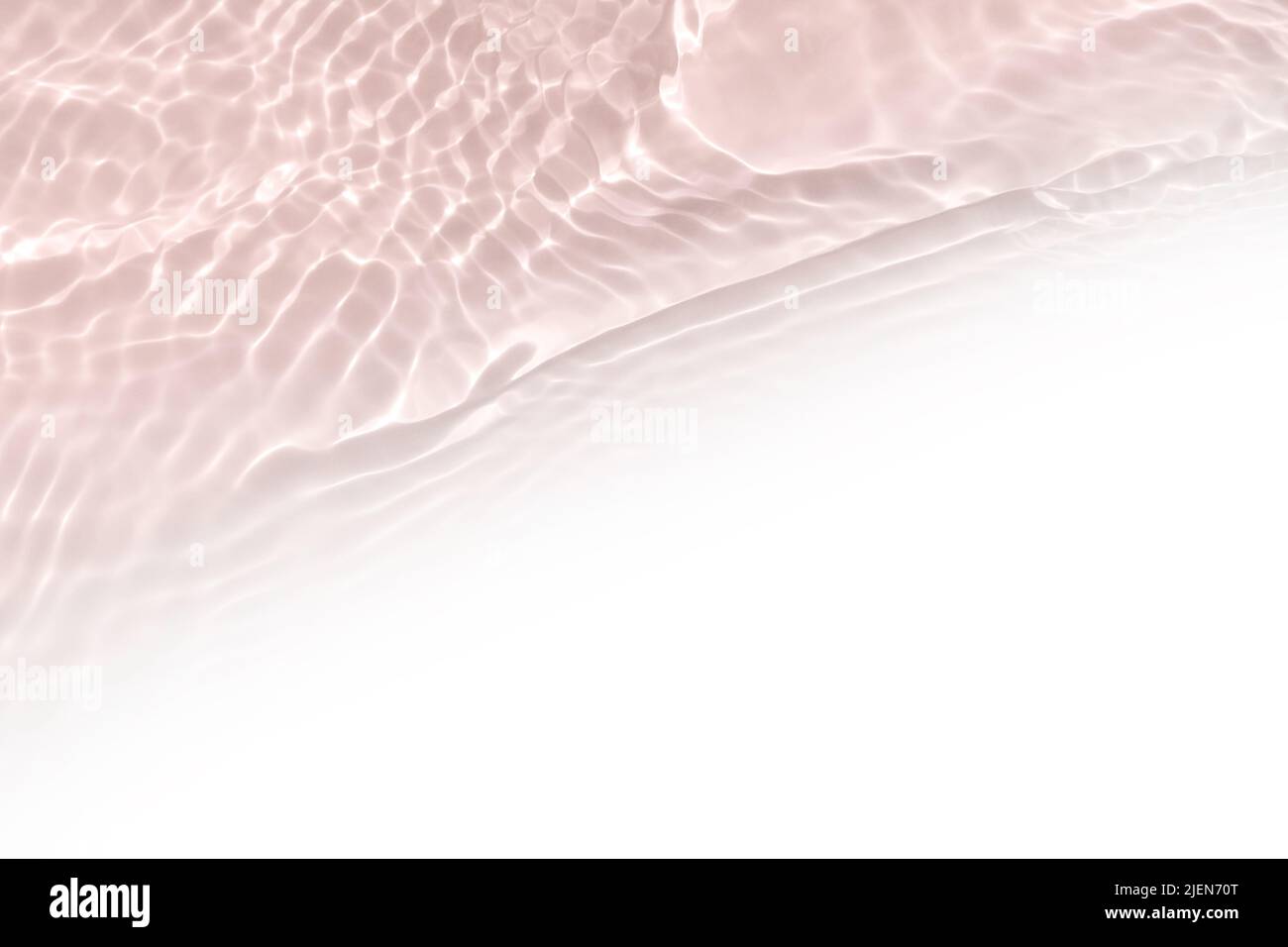 Surface of toned in pastel pink swimming pool water with light ...