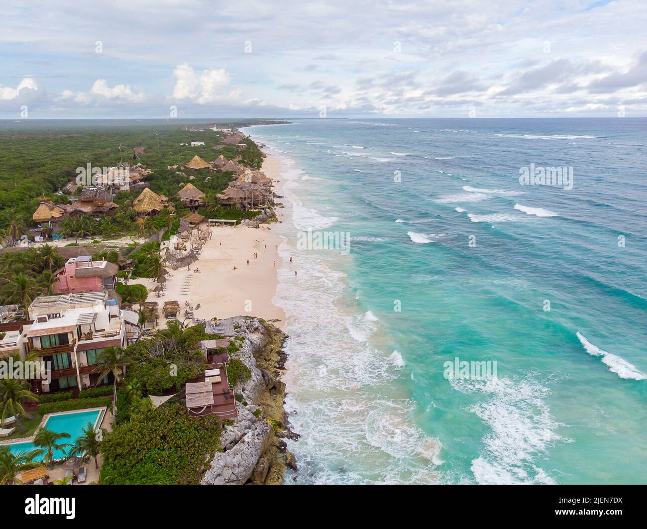 Aerial view of Tulum white sand beach with waves of Caribbean Sea ...