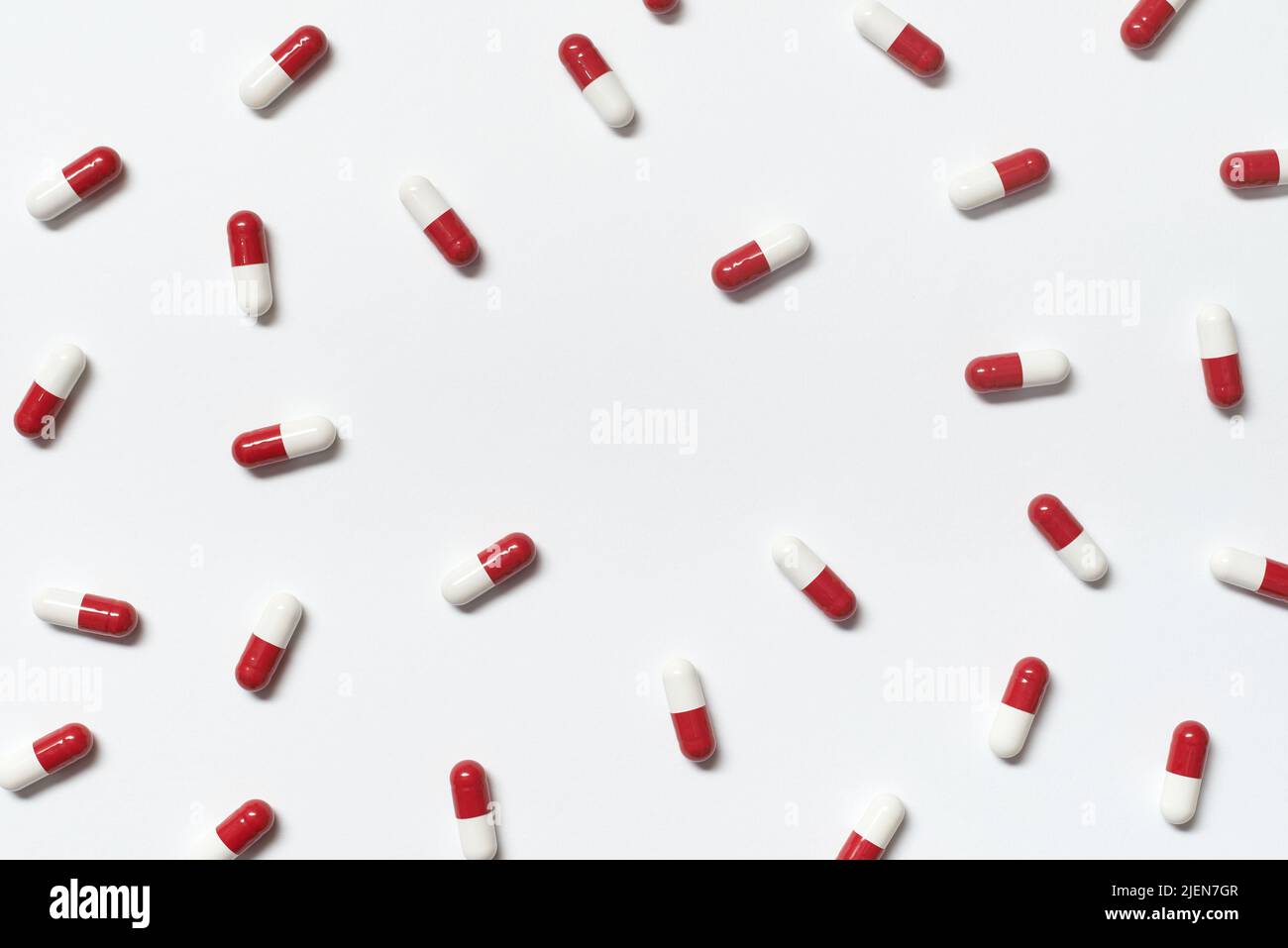 Pharmaceutical capsules over white backdrop Stock Photo - Alamy