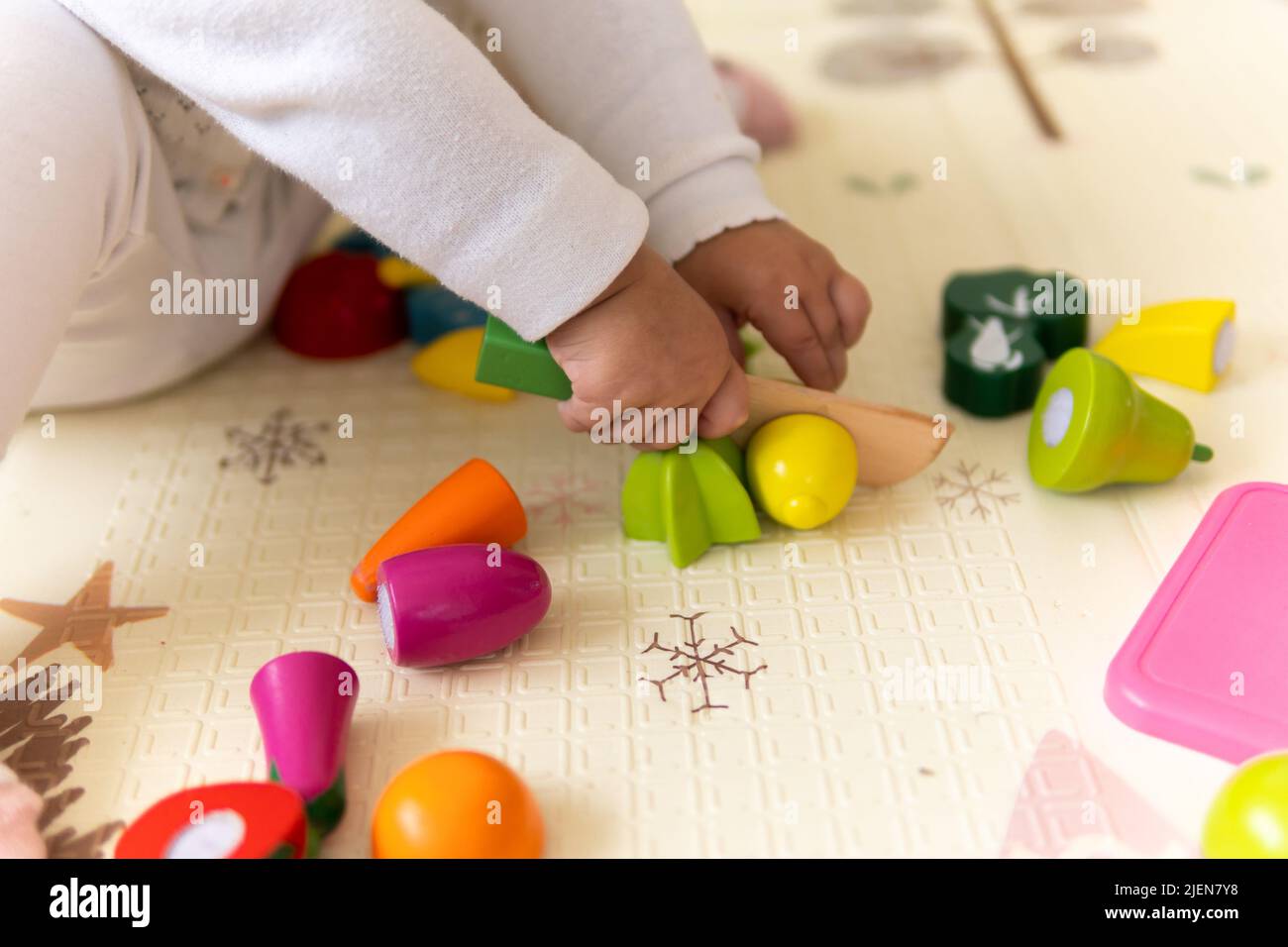 happy funny kid curly baby girl with educational toy blocks flowers ...