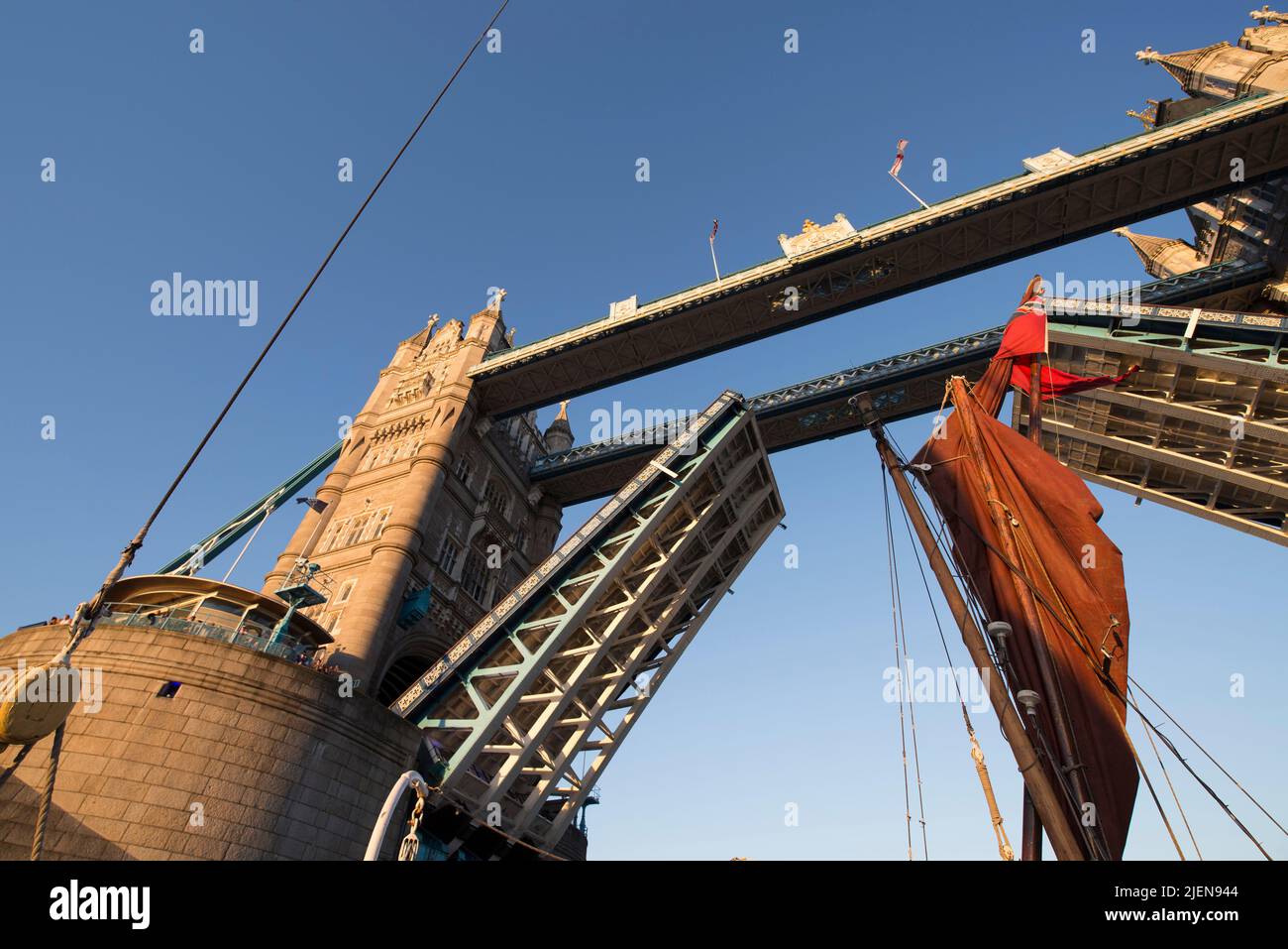 Old sailing barge sailing down the River Thames and under Tower Bridge ...