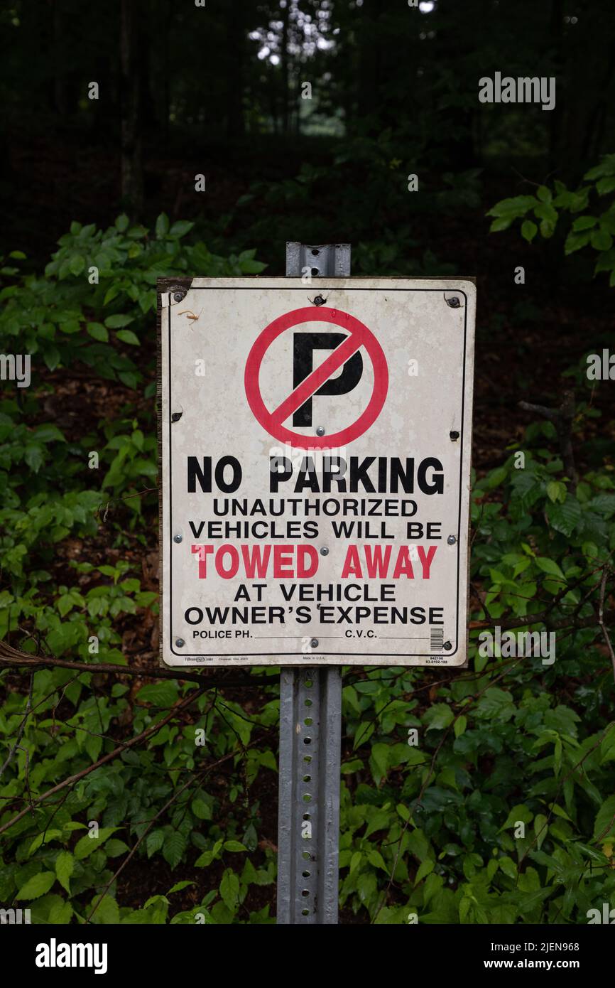 Old Rusty Metal No Parking Sign in Woods Stock Photo - Alamy