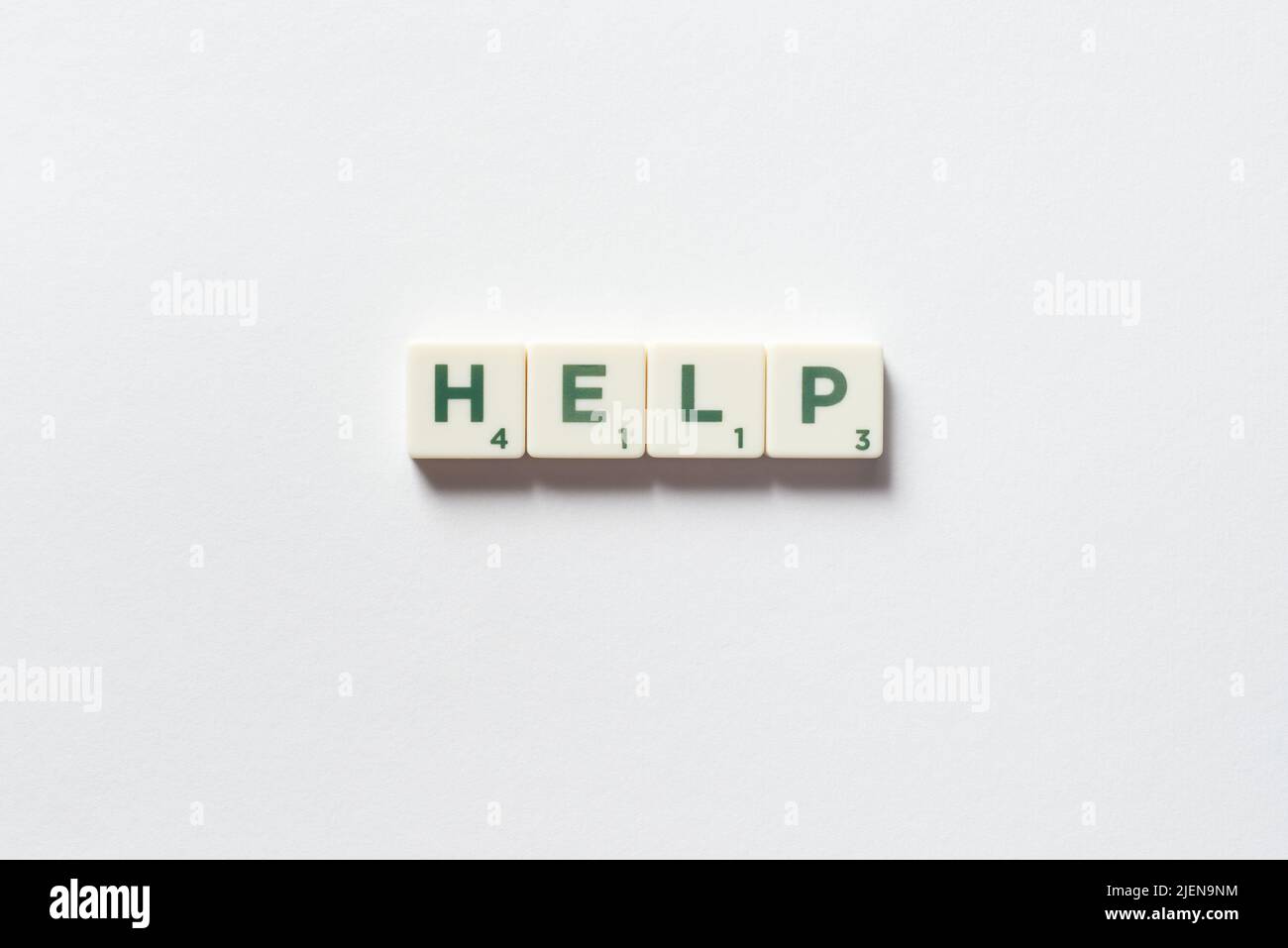 Help formed of scrabble blocks Stock Photo - Alamy