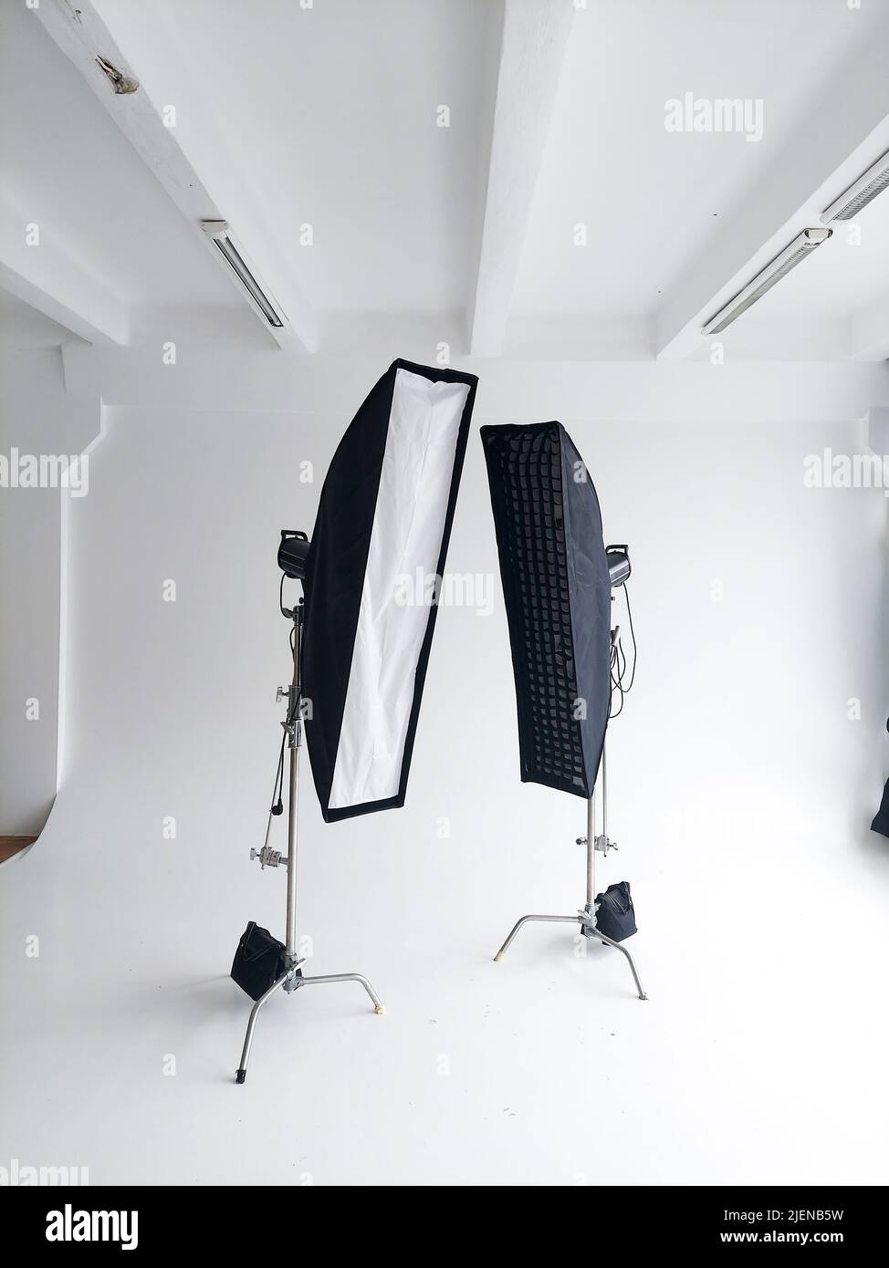 Lighting equipment on a cyclorama in modern photo studio. Two ...