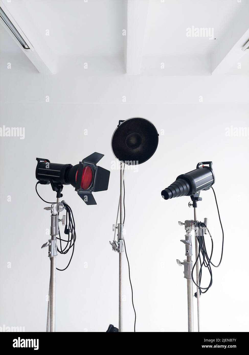 Professional lighting equipment, flashes, c-stands on a cyclorama in ...