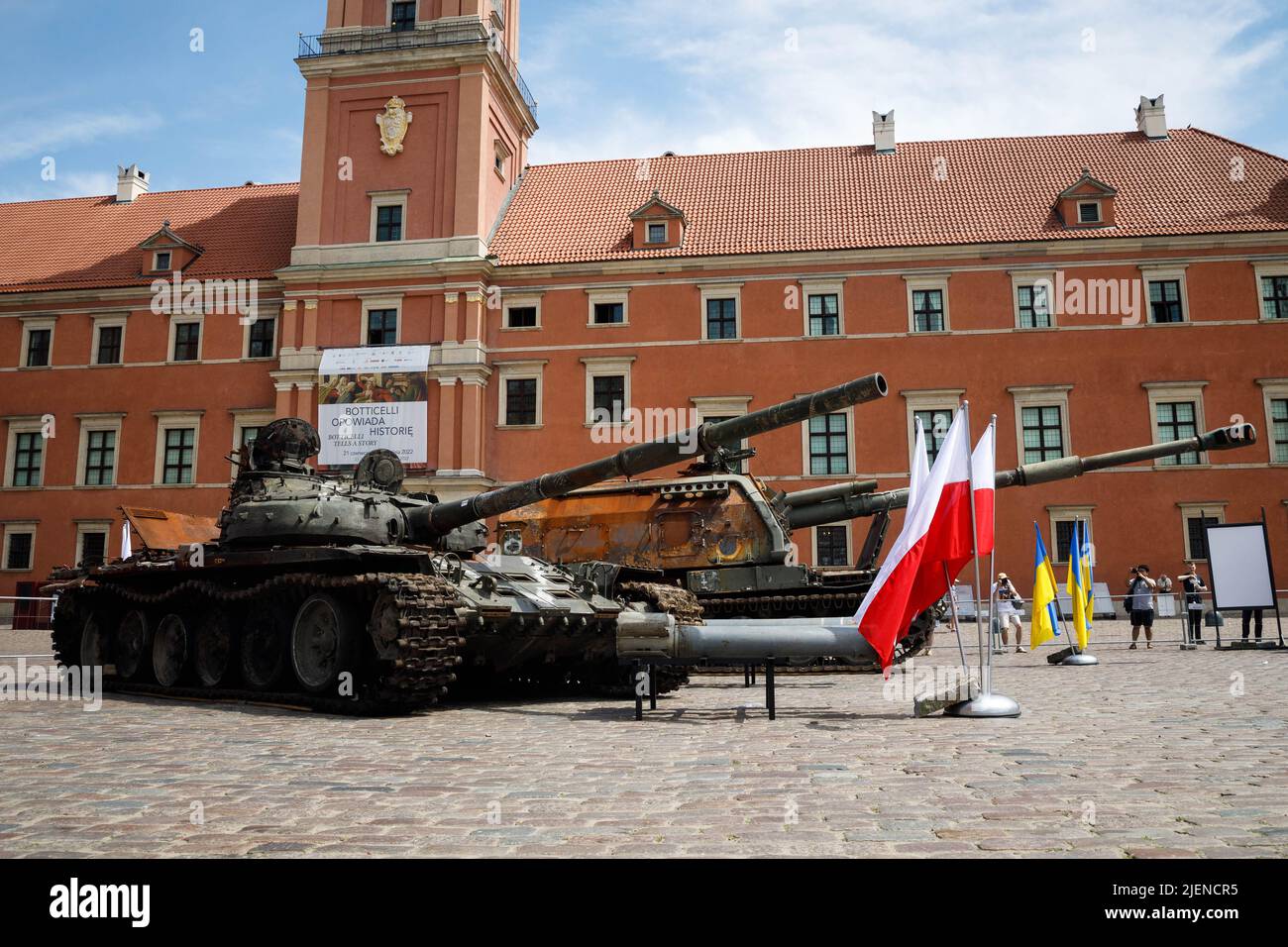 Polish and Ukrainian flags are seen near the destroyed Russian tank T ...