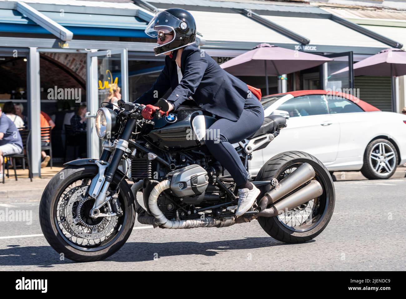 Woman riding motorcycle side view hi-res stock photography and images ...