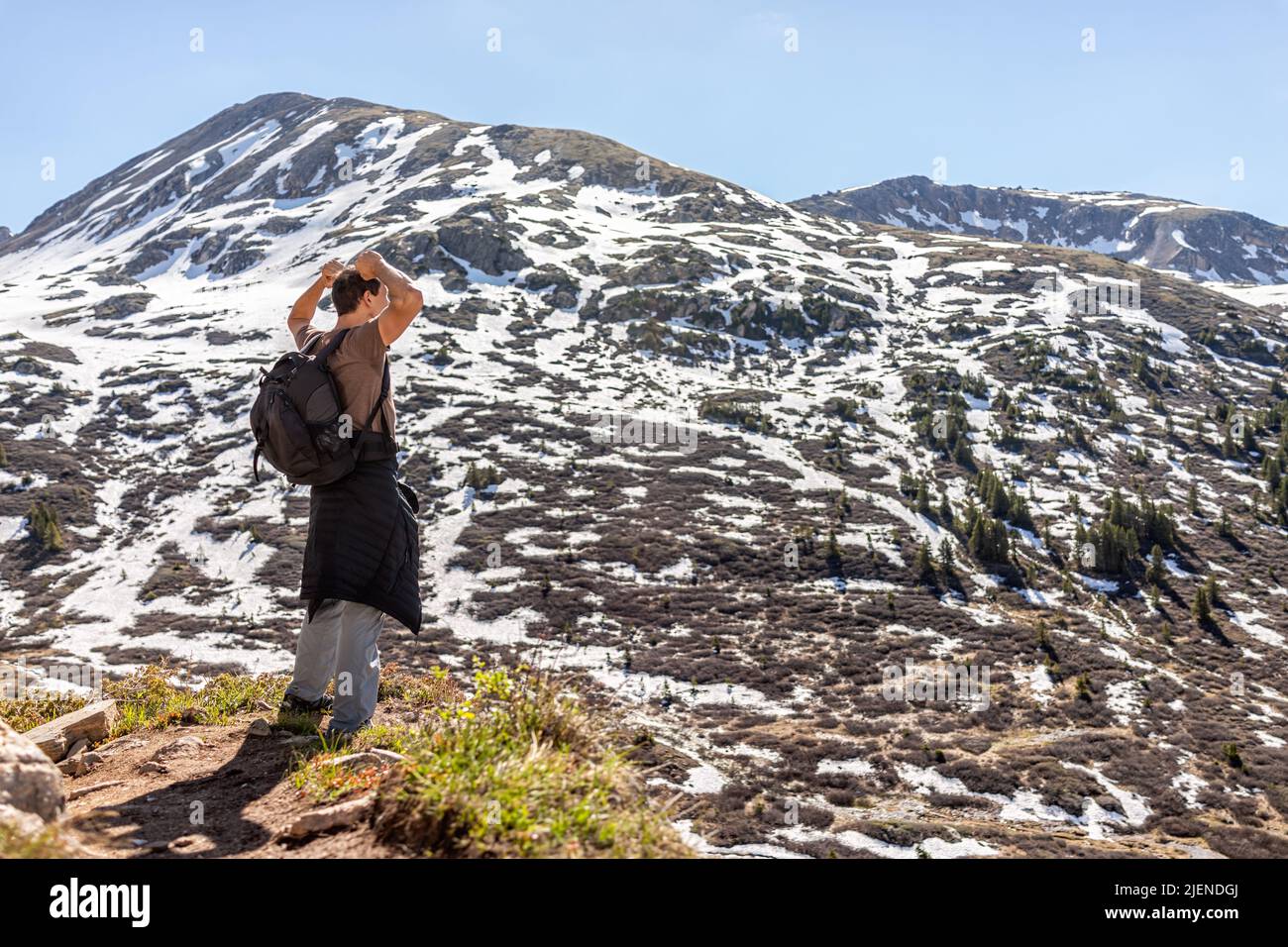 Man with arms flexed with freedom on Linkins Lake trail peak top on ...