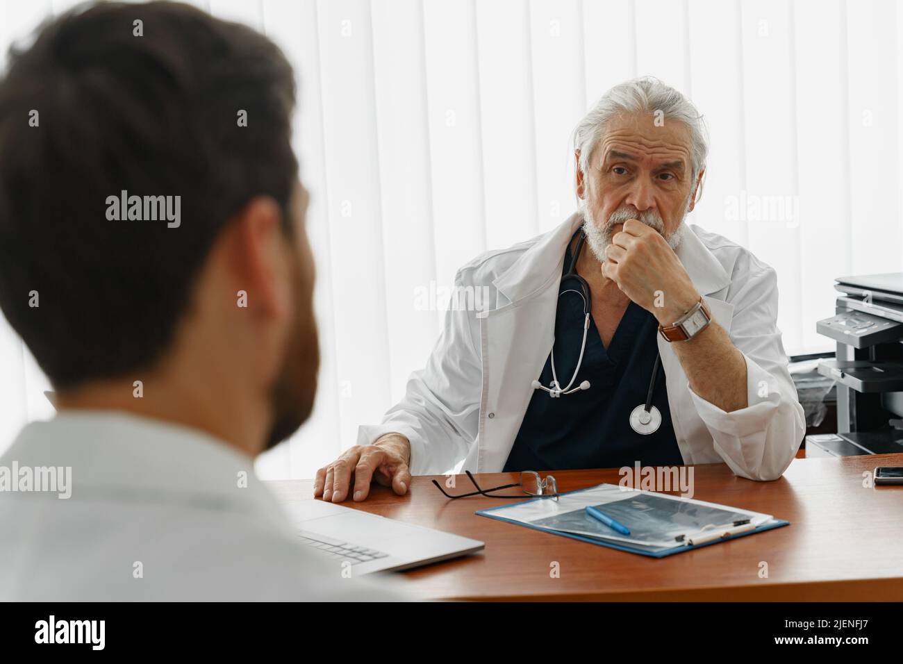 Successful medical doctors are discussing diagnosis during the ...
