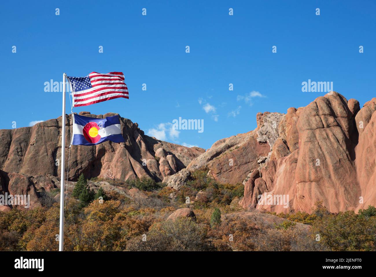 US flag in front of red rock formation at Roxborough State Park in ...