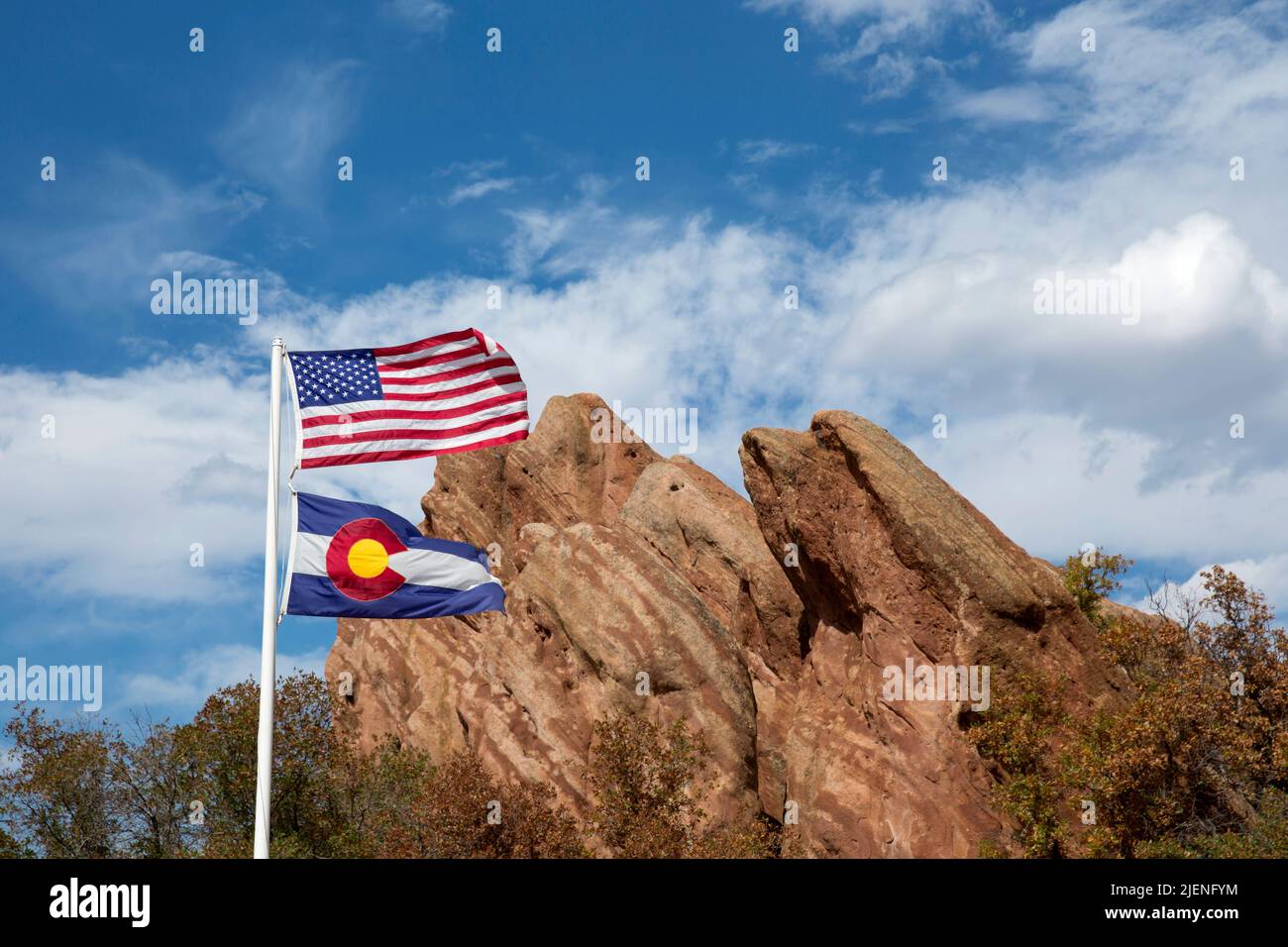 US flag in front of red rock formation at Roxborough State Park in ...