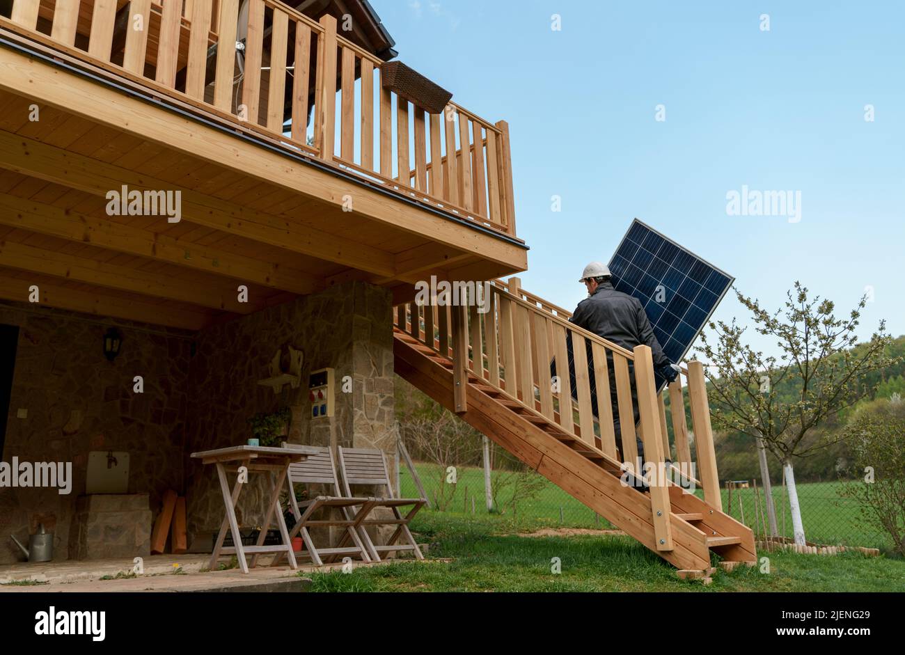 Man worker carrying solar panel for installing solar modul system on ...