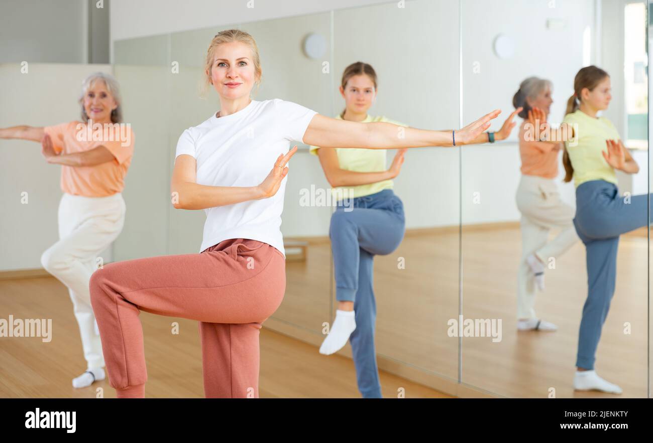 Female doing dance workout during group classe in fitness center Stock ...